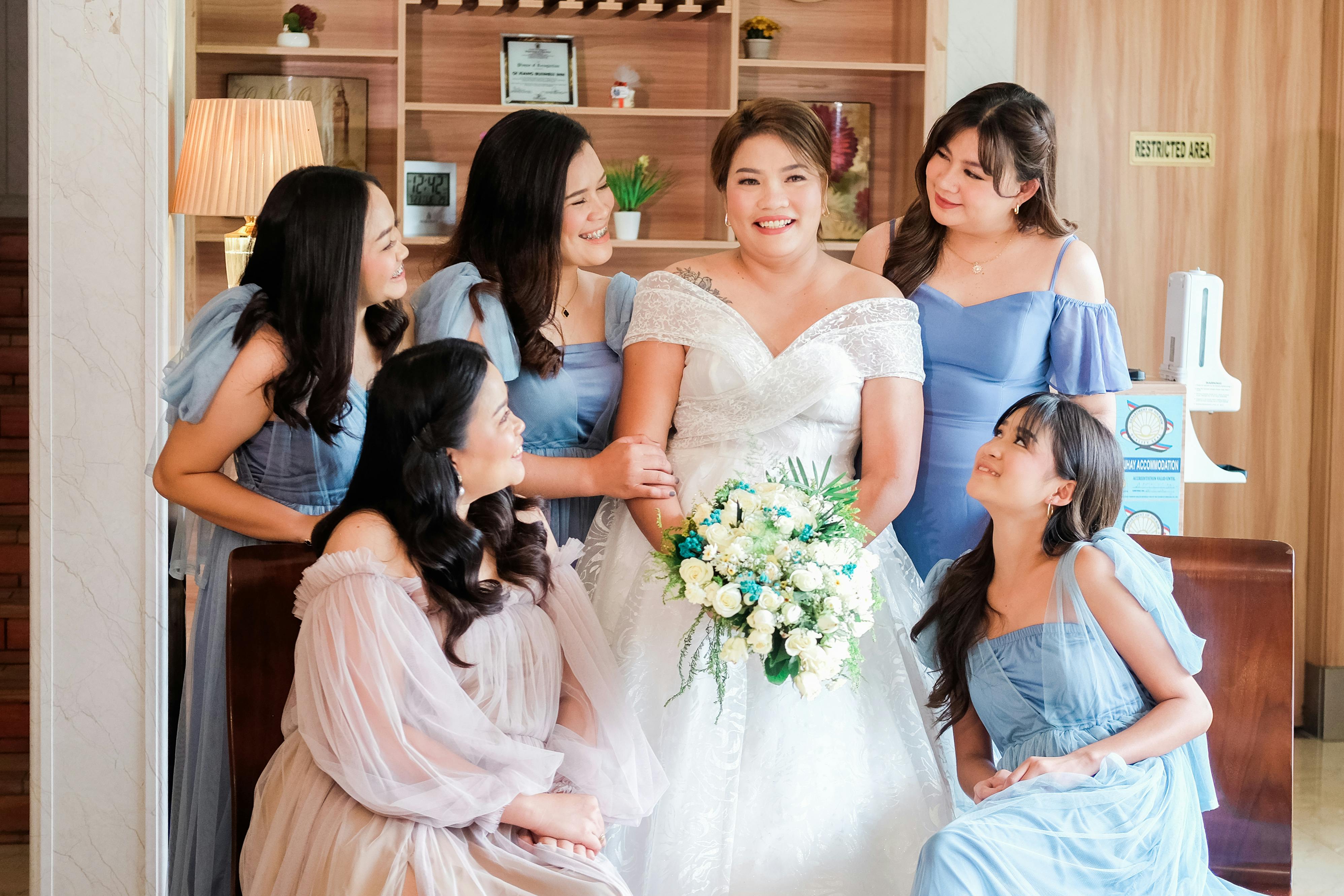 Joyful Bride with Bridesmaids in Blue · Free Stock Photo