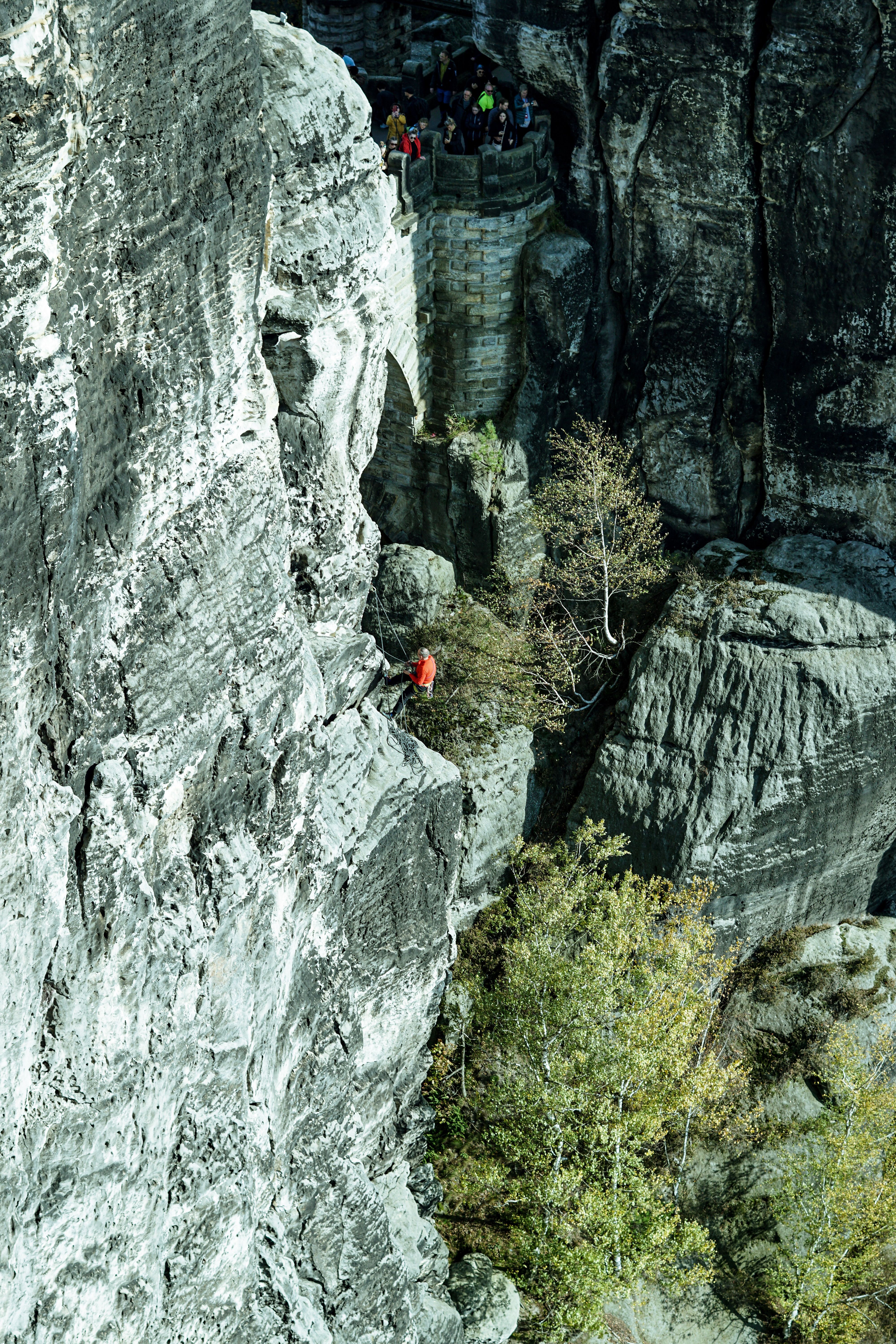Rock Climber Scaling Rugged Cliff at Bastei · Free Stock Photo