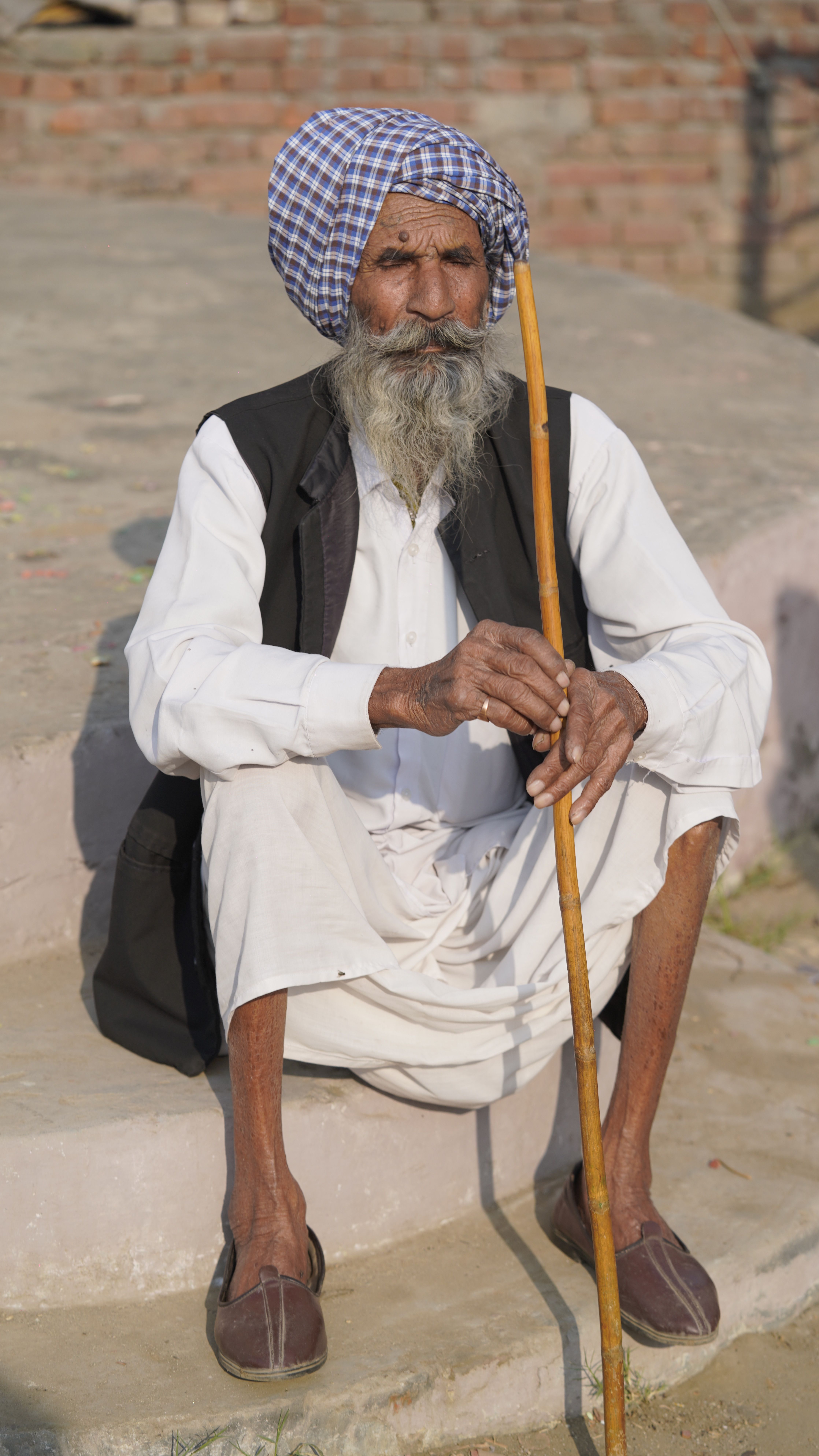 Elderly Man with Turban in Rural Setting · Free Stock Photo