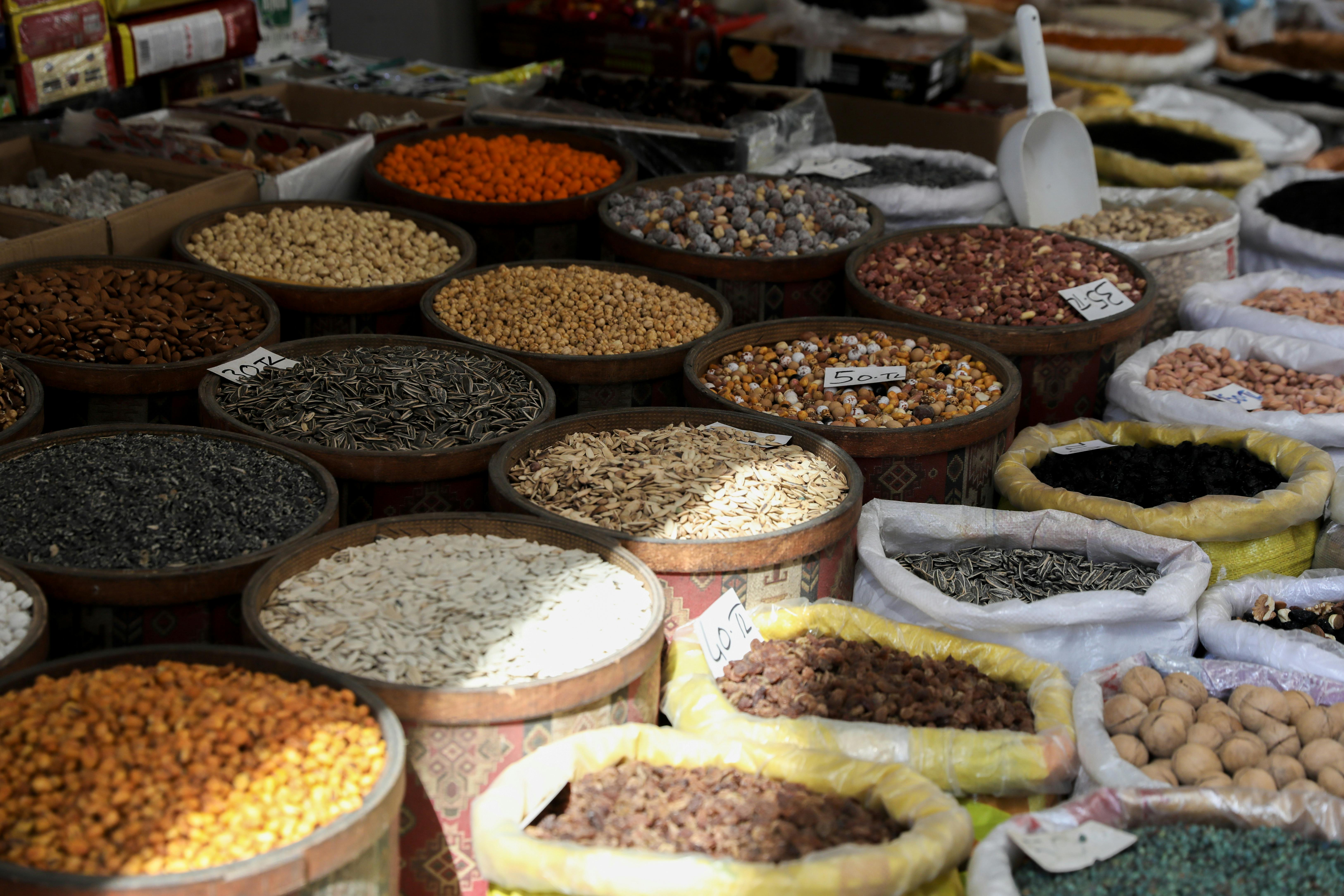 Diverse Assortment of Nuts and Seeds at Market · Free Stock Photo