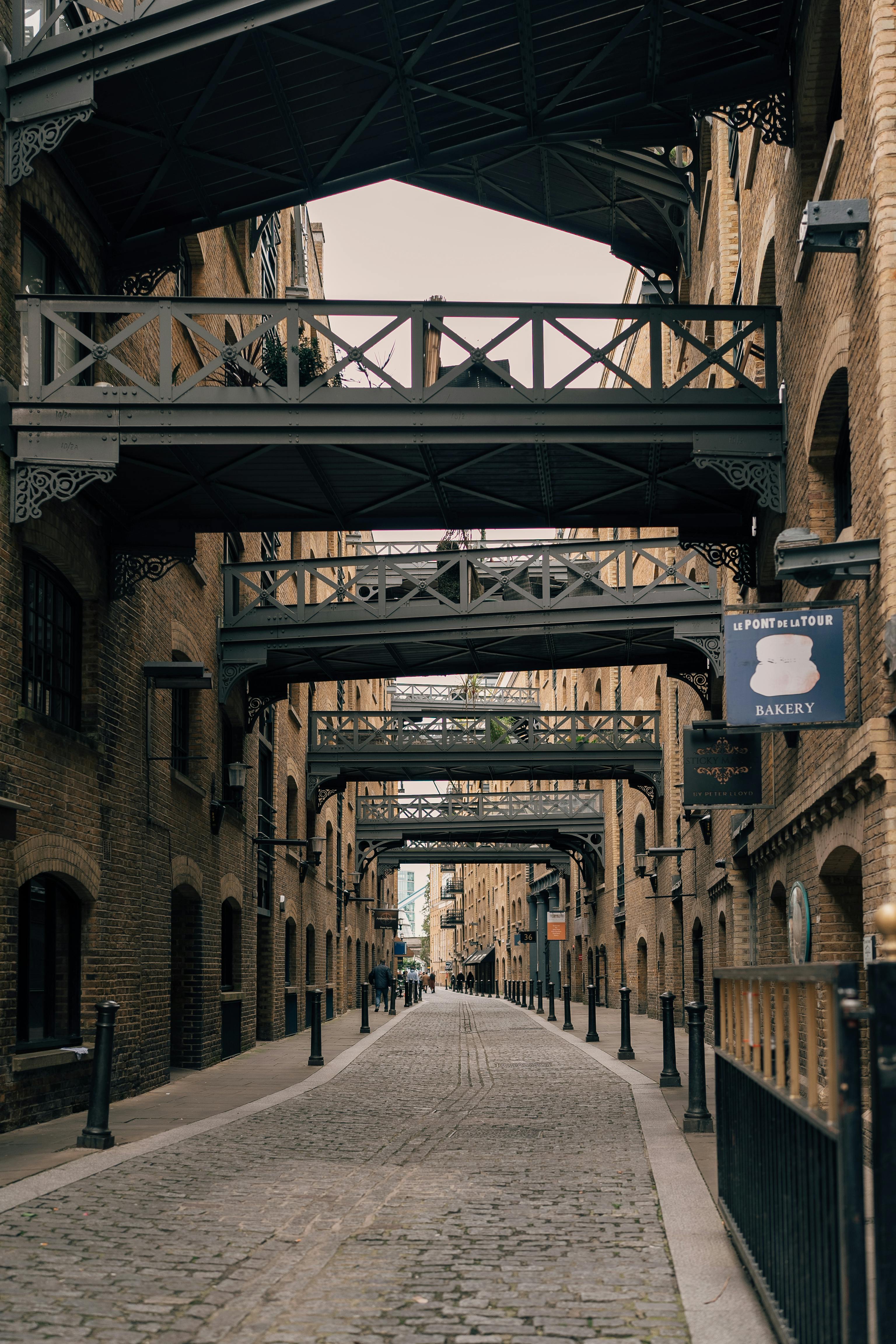 Historic London Alley with Industrial Bridges · Free Stock Photo