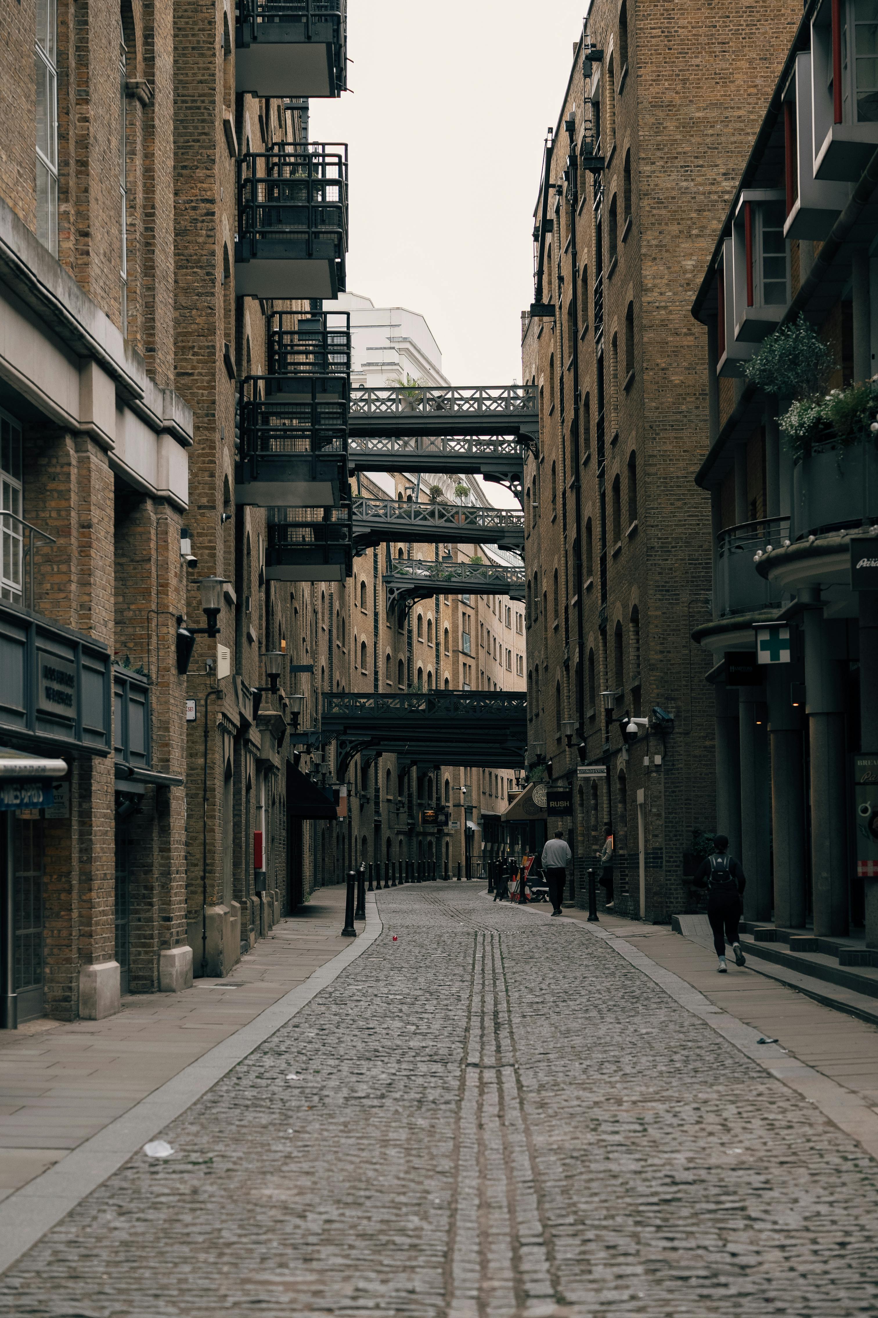 Historic London Alley with Intricate Footbridges · Free Stock Photo