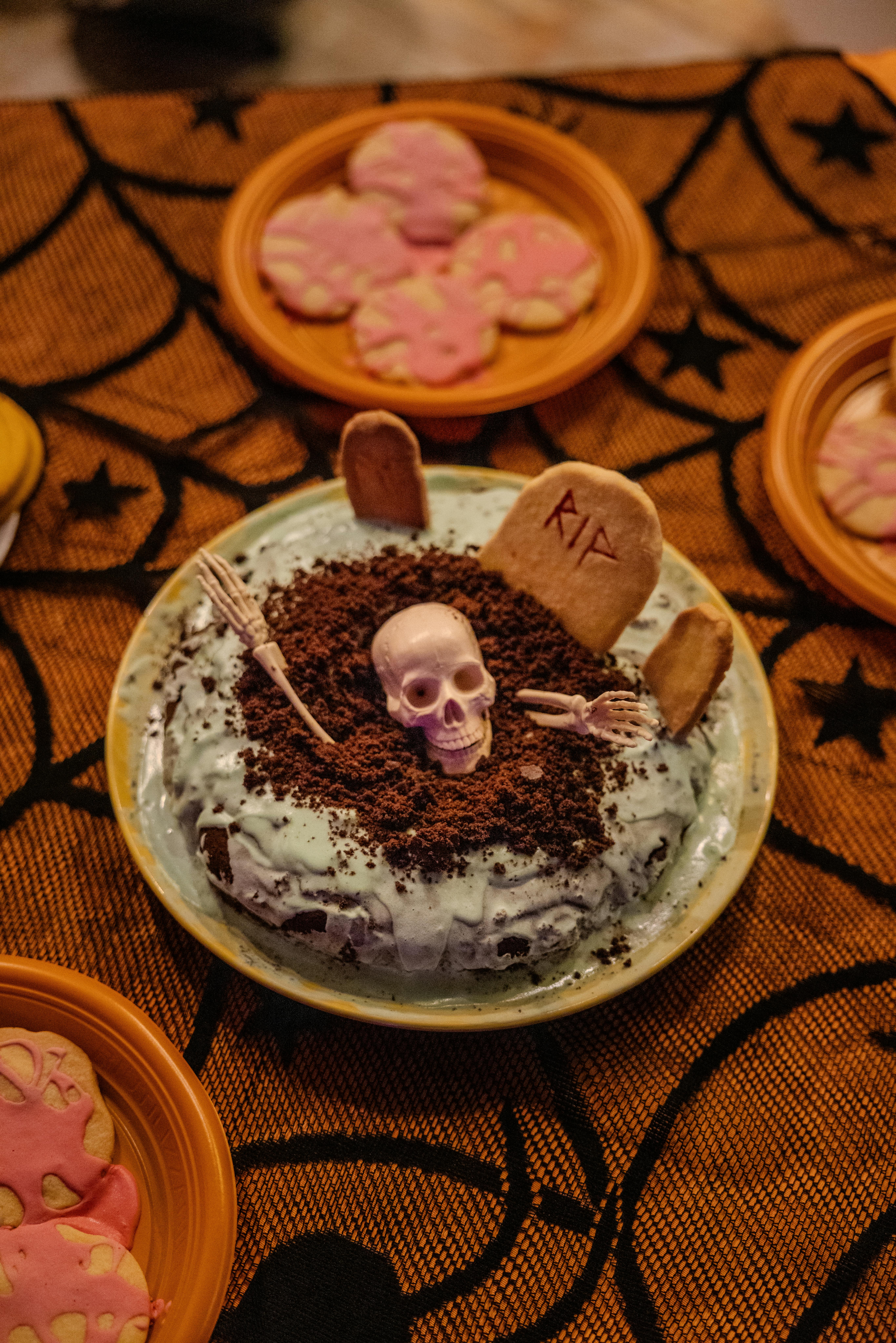 Halloween-Themed Graveyard Cake with Skull · Free Stock Photo