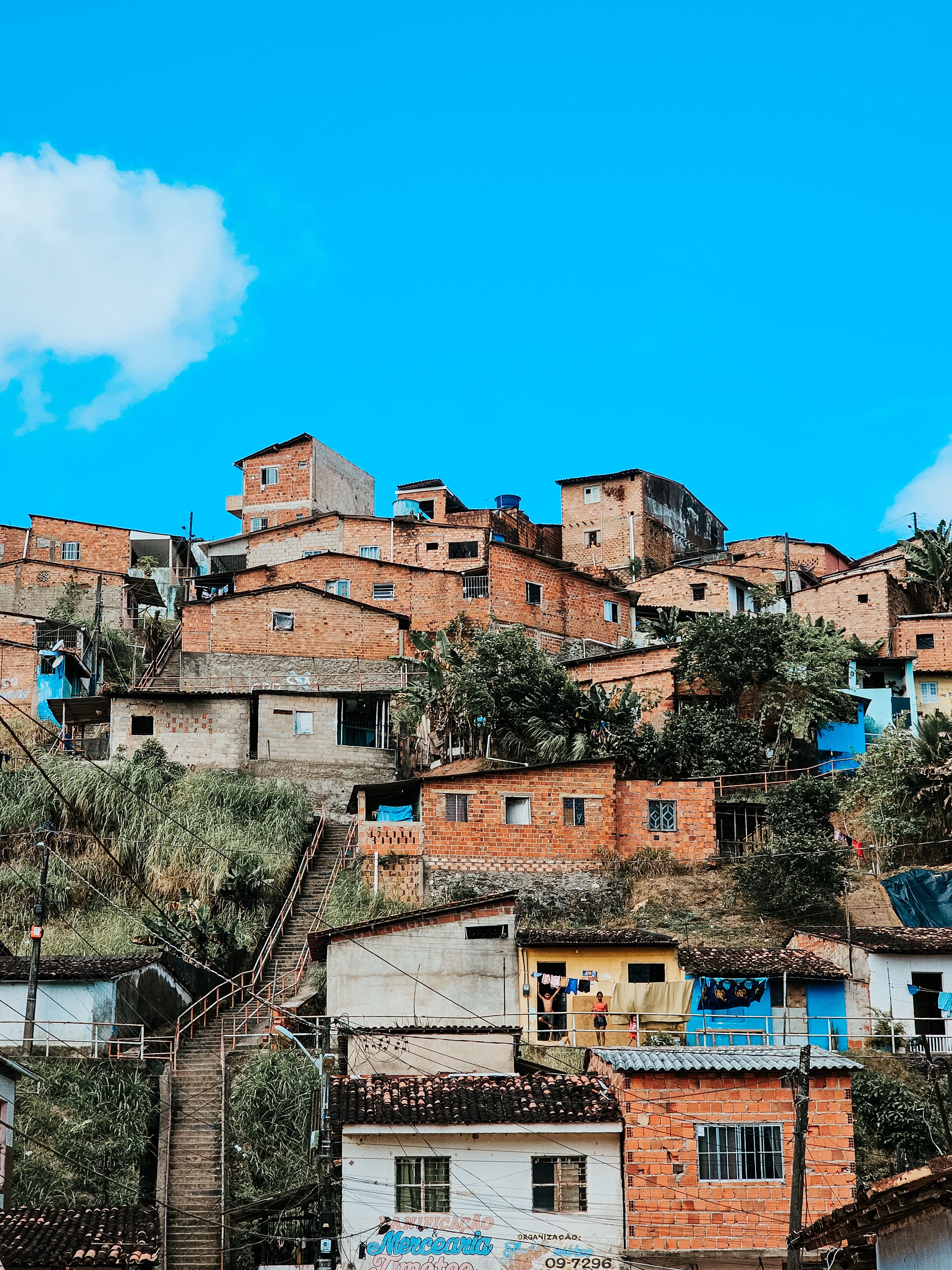 Colorful Favela Houses Against a Clear Sky · Free Stock Photo