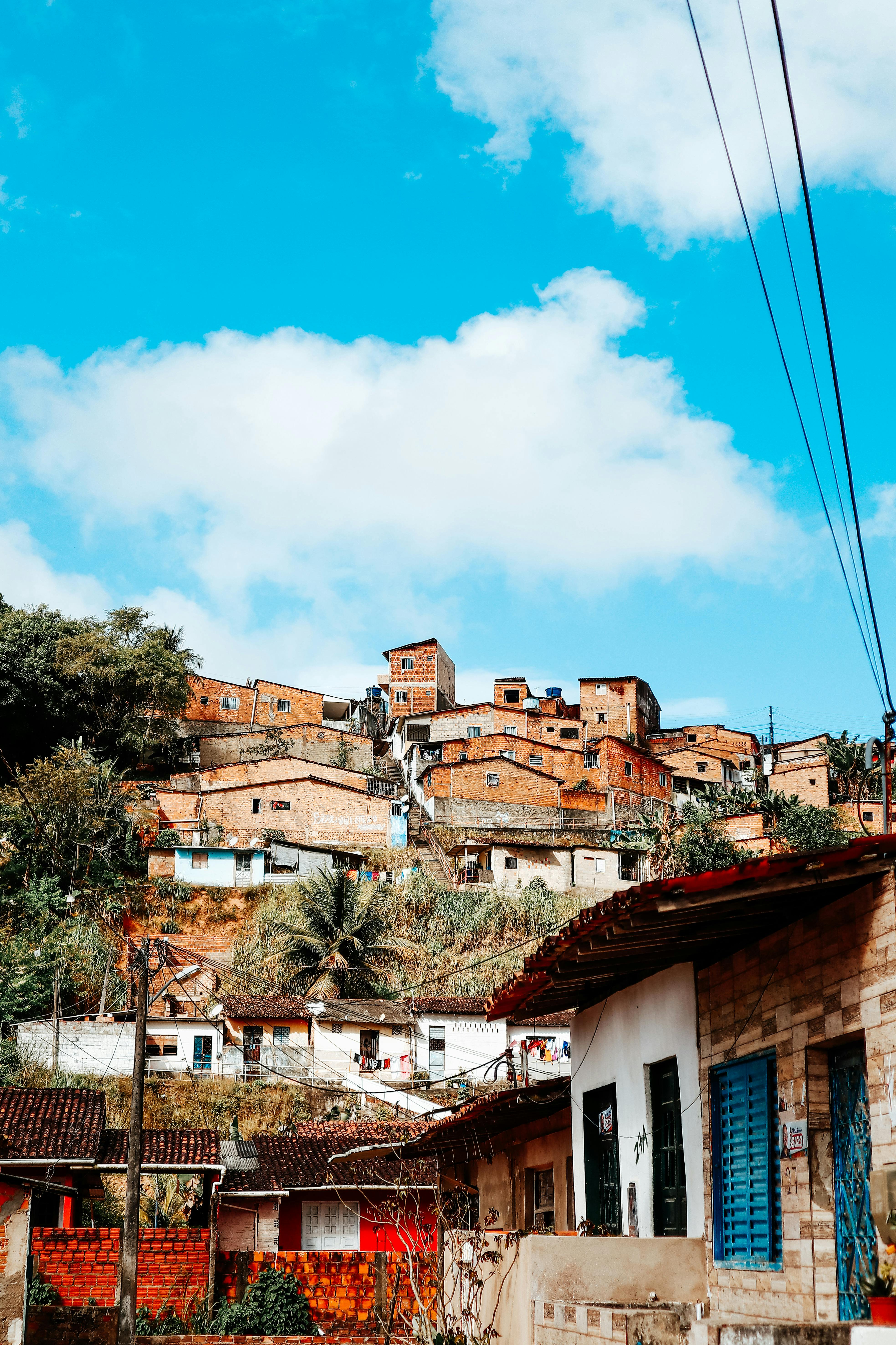 Colorful Favela Houses under Bright Blue Sky · Free Stock Photo