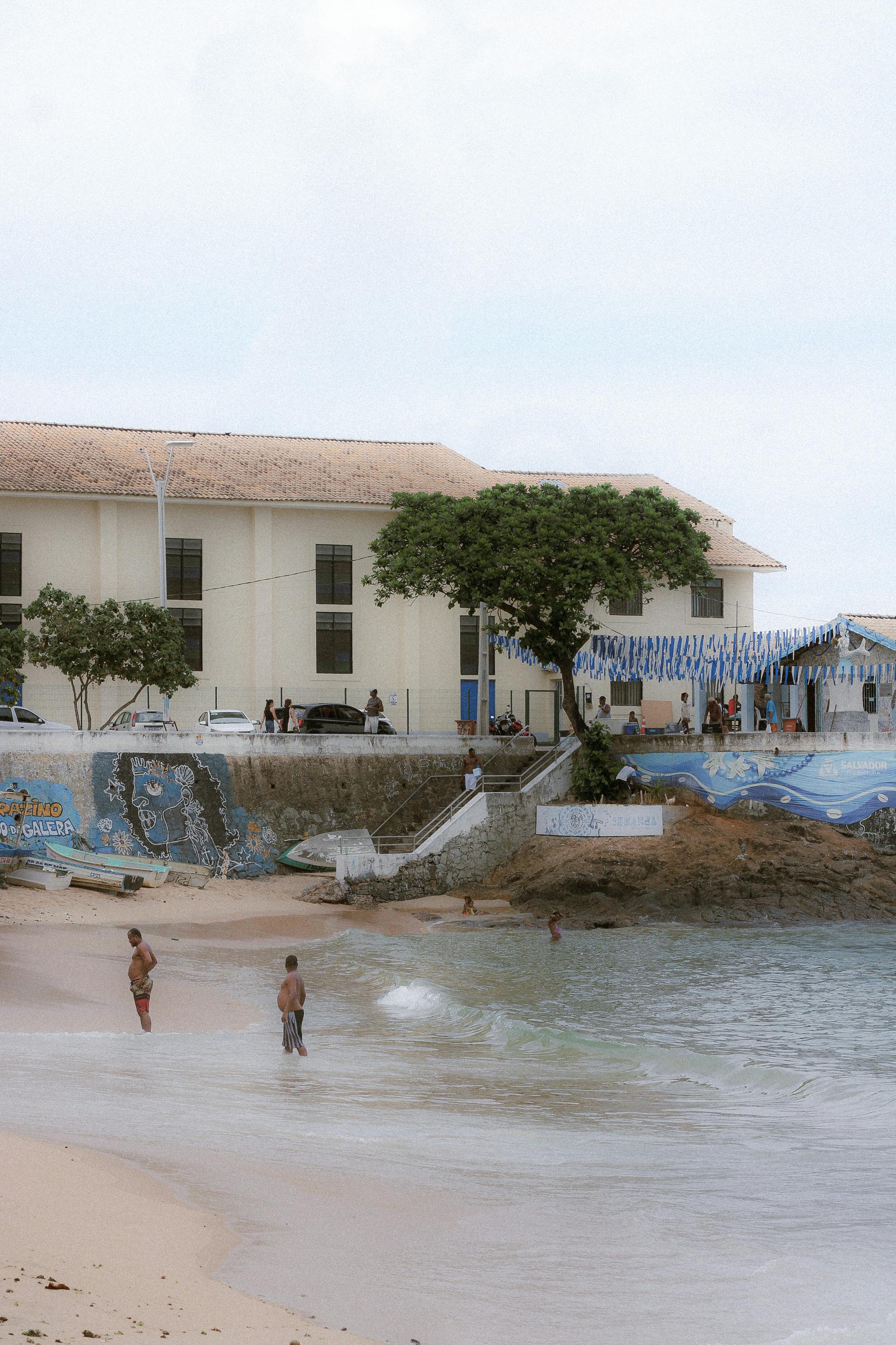 Beachfront Urban Scene with People by the Sea · Free Stock Photo