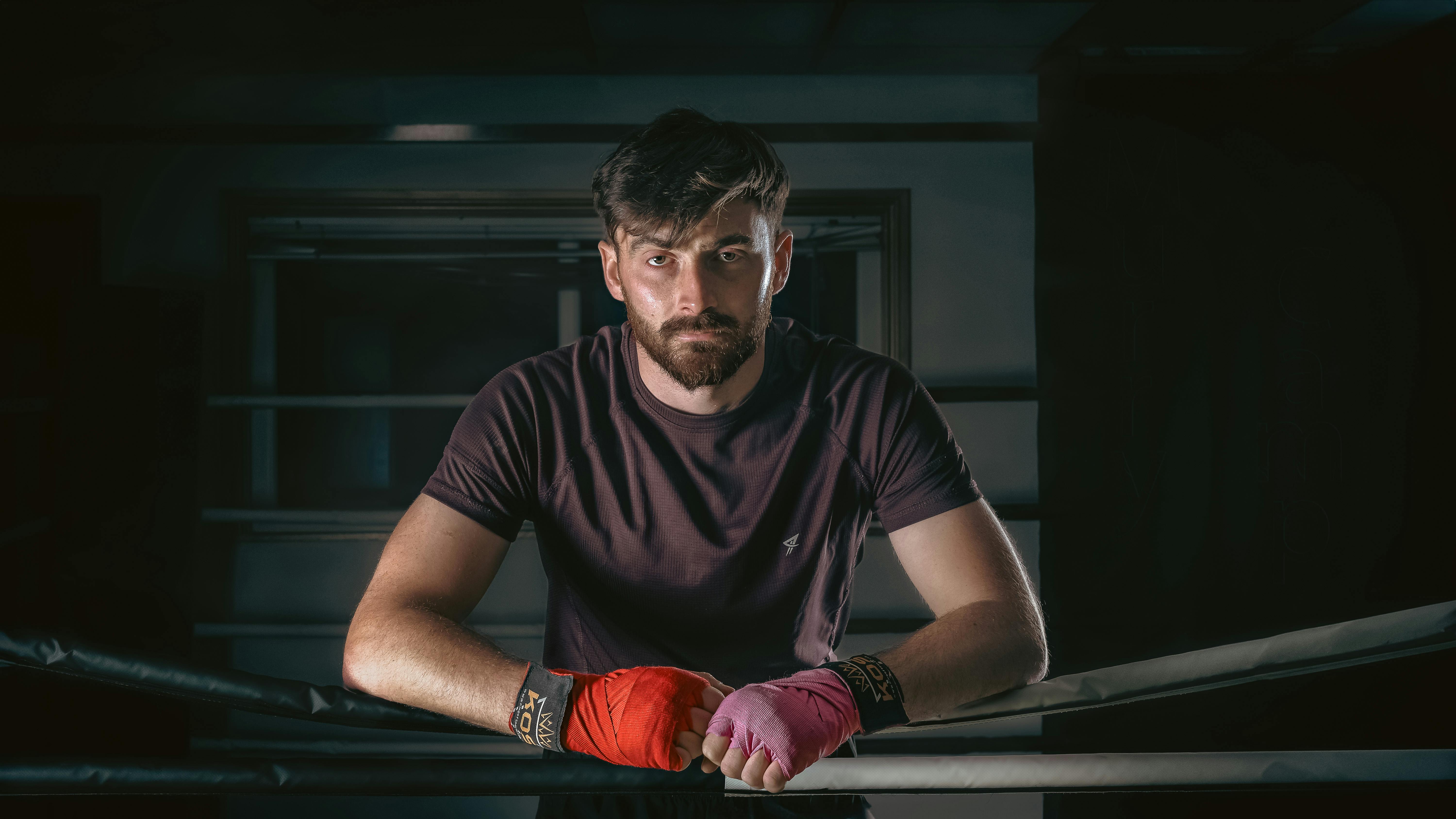 Determined Boxer Resting in Training Ring · Free Stock Photo