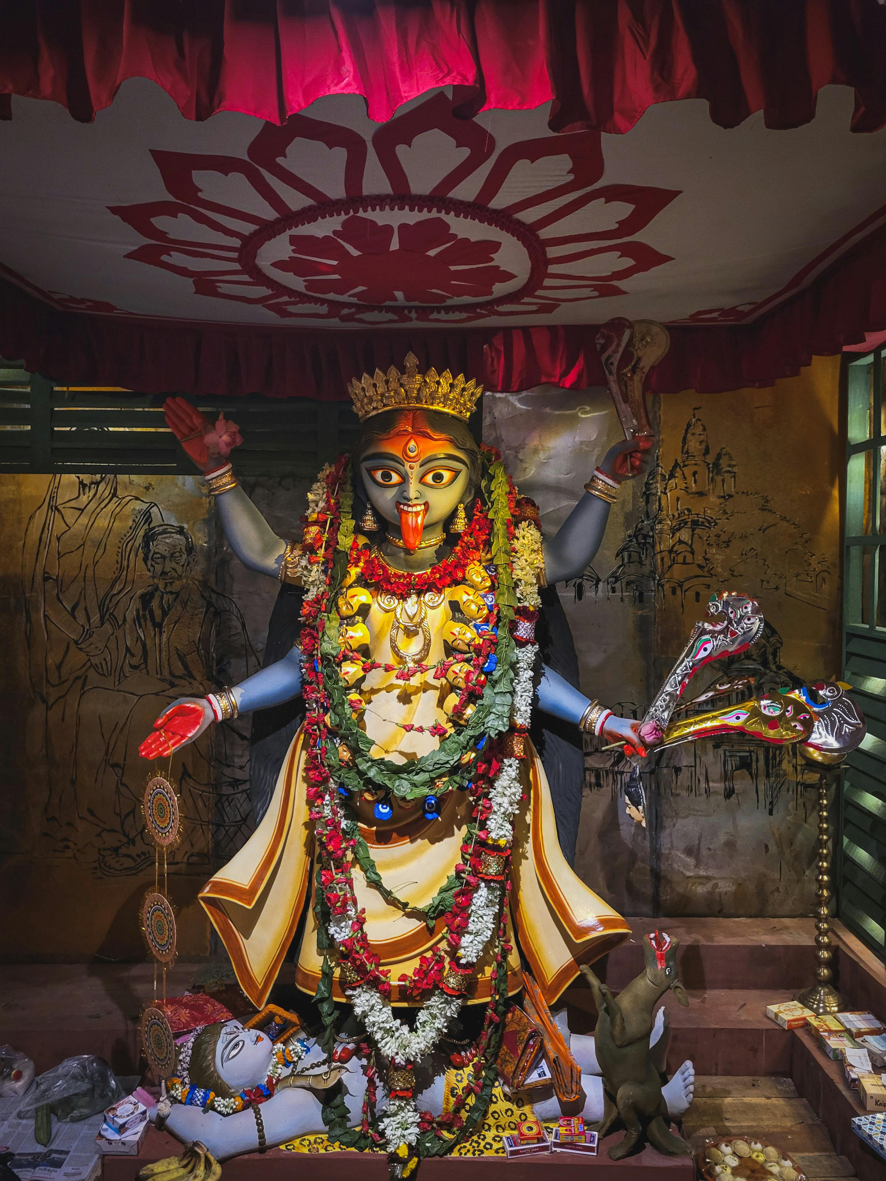 Statue of Hindu God Kali Puja on Black Background · Free Stock Photo