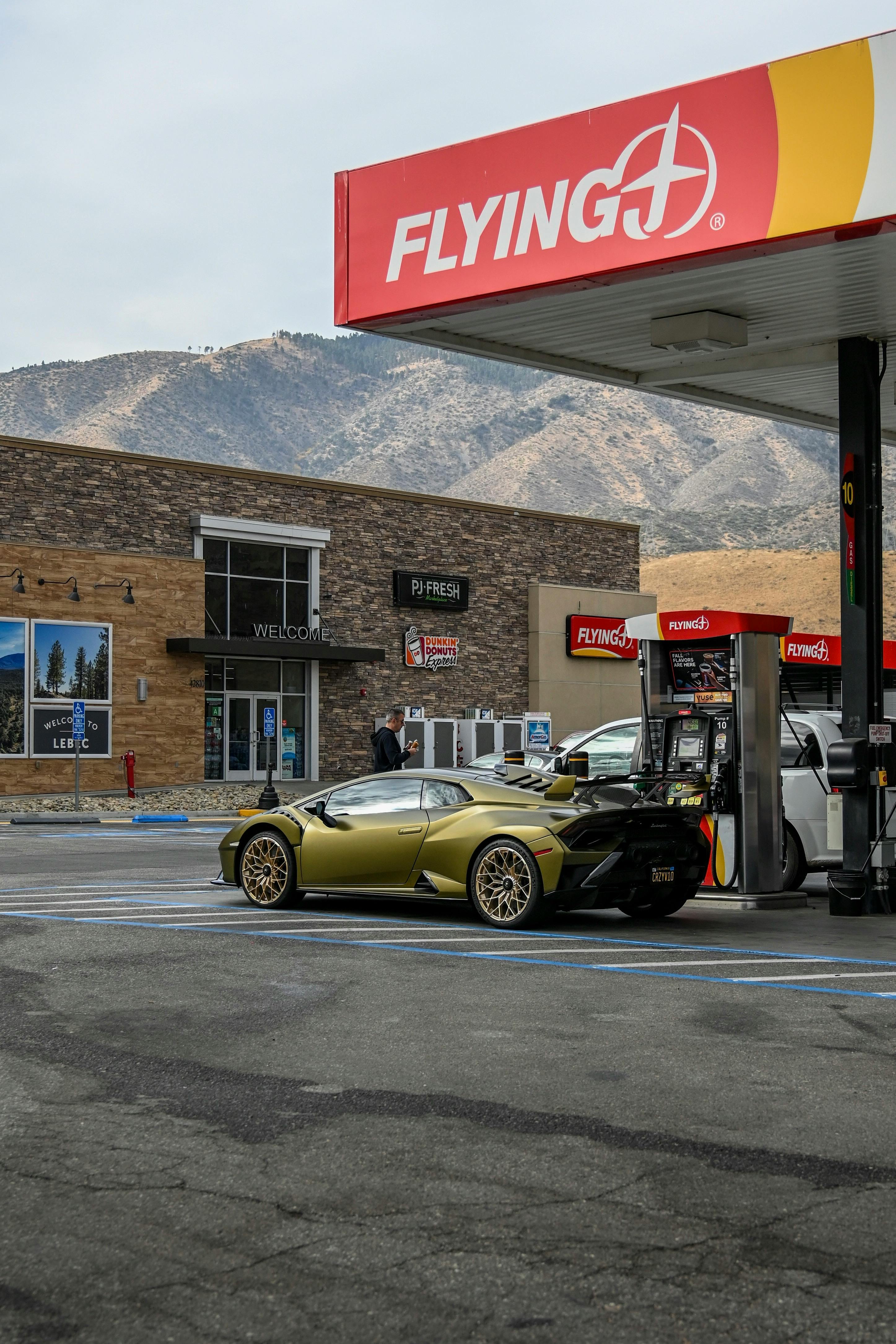 Luxury Car at Flying J Gas Station with Mountain View · Free Stock Photo