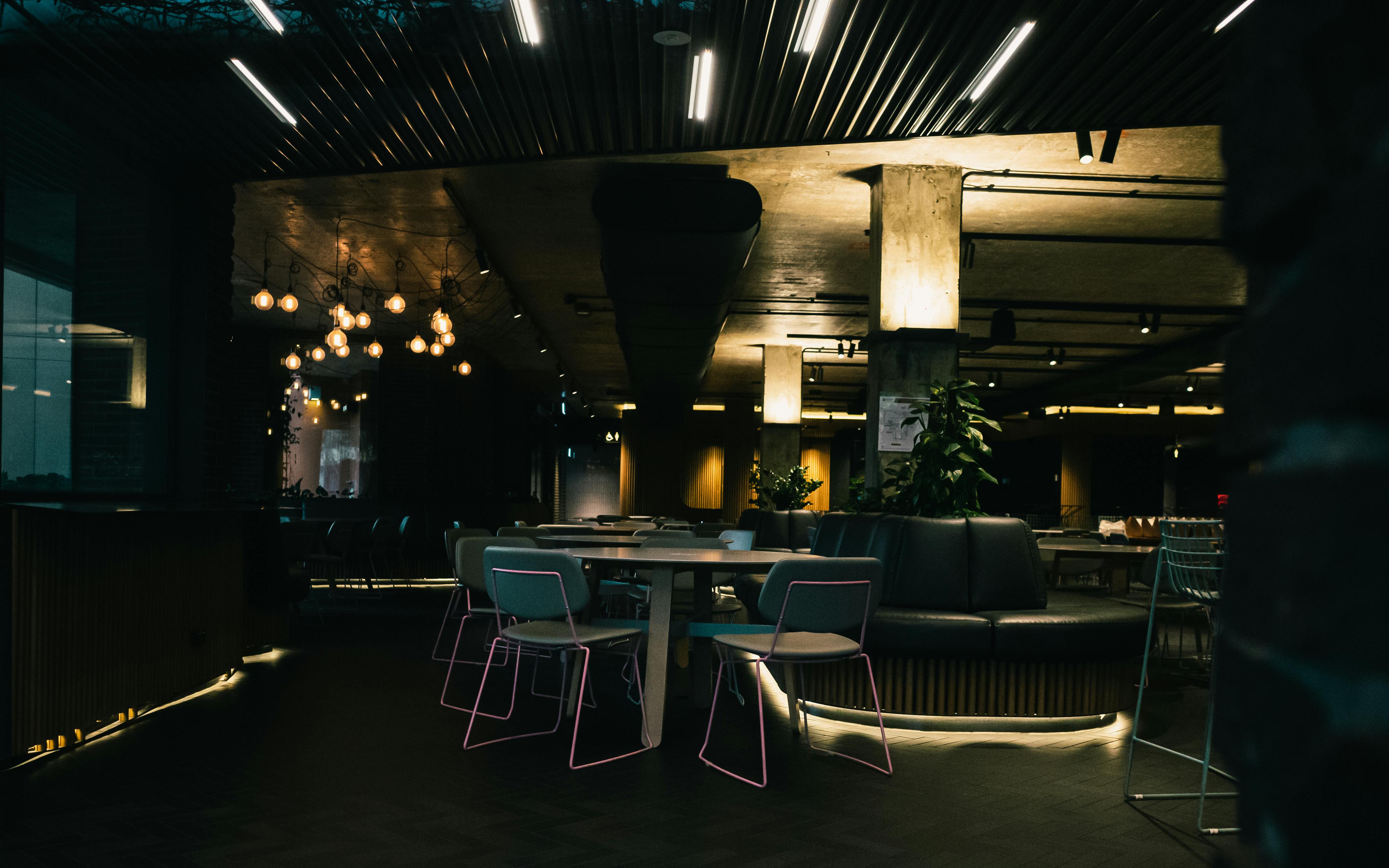 Modern Empty Restaurant Interior with Dim Lighting · Free Stock Photo