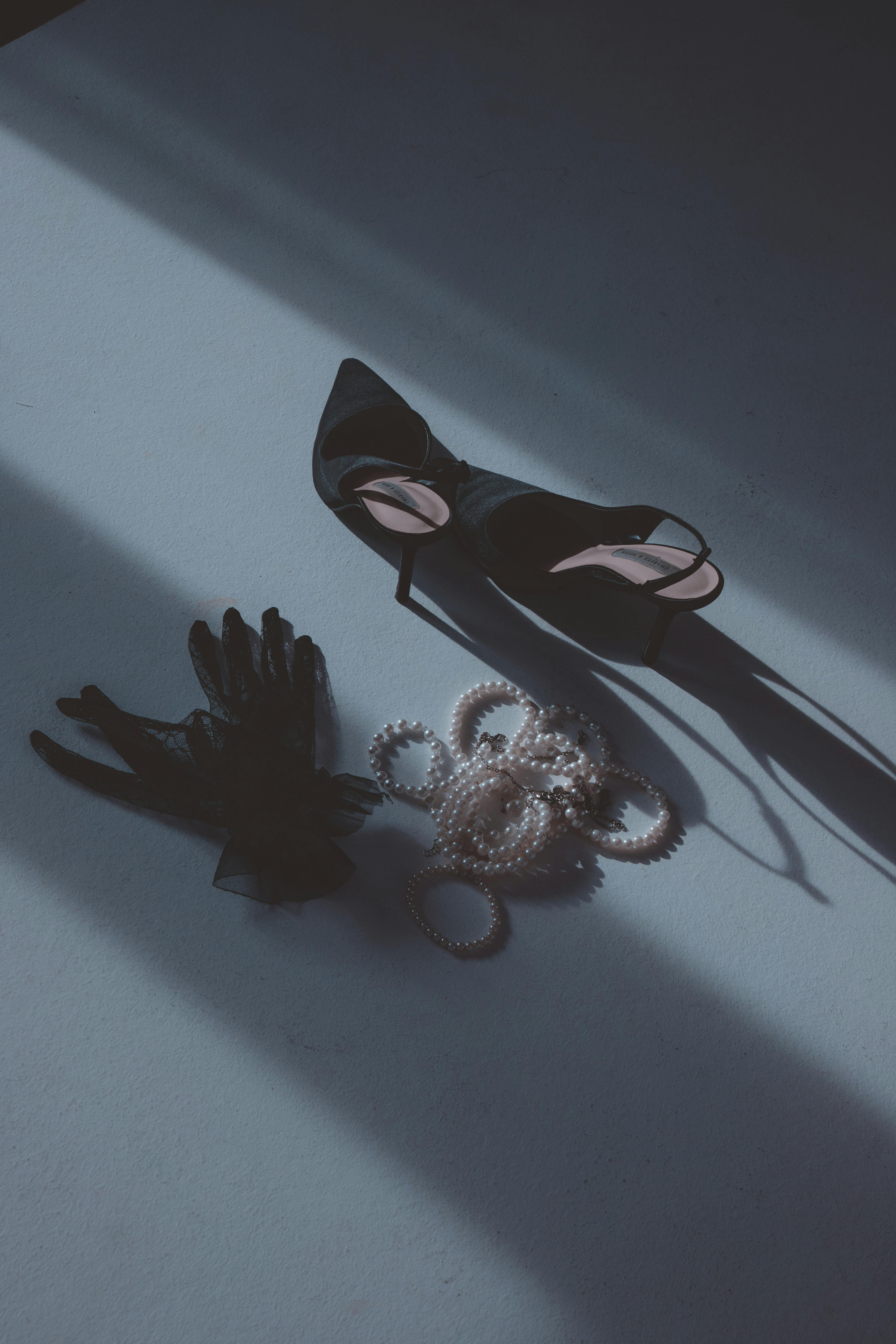 Elegant Black Heels with Pearls and Gloves in Shadow · Free Stock Photo