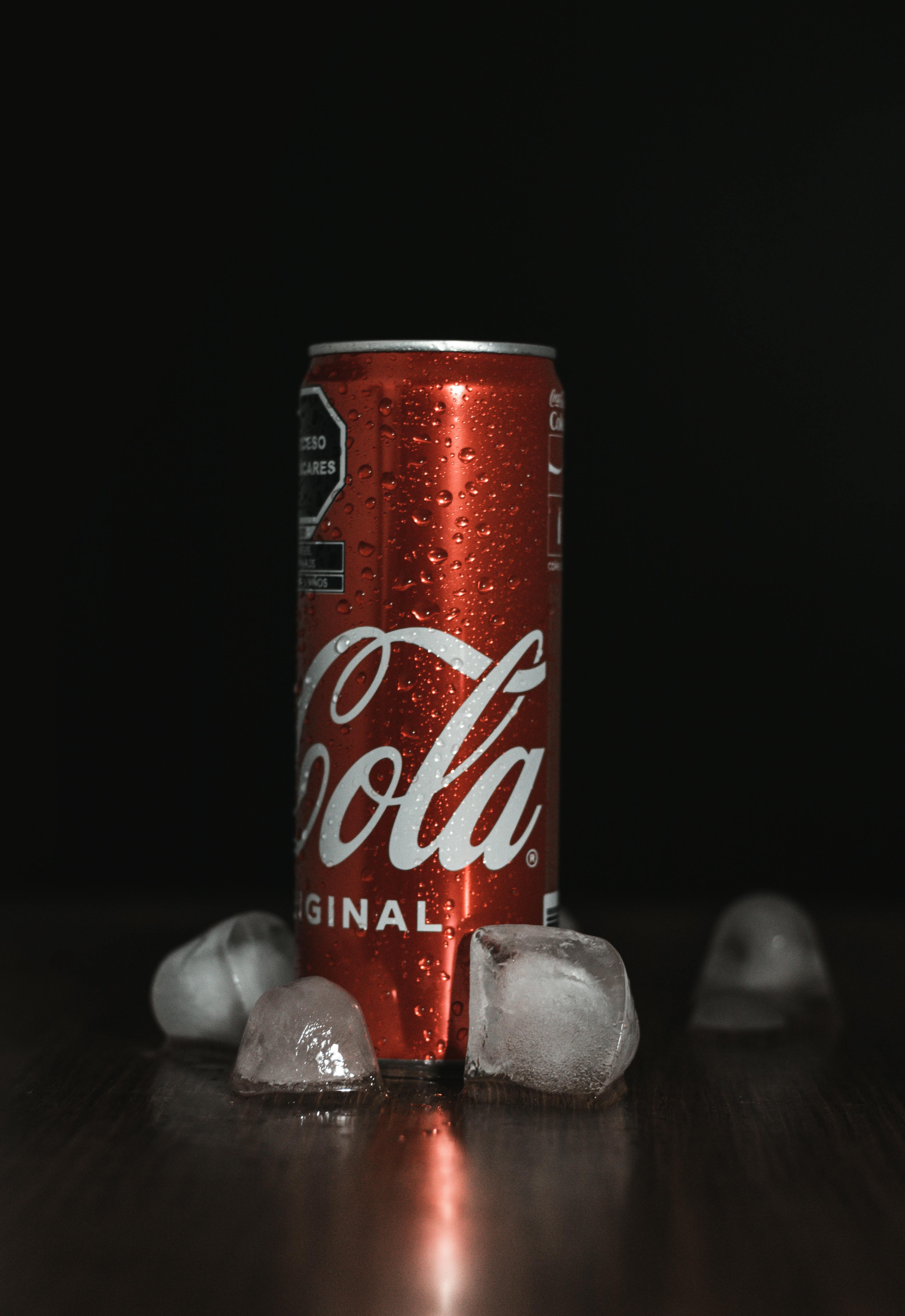 Chilled Soda Can with Ice Cubes on Dark Background · Free Stock Photo