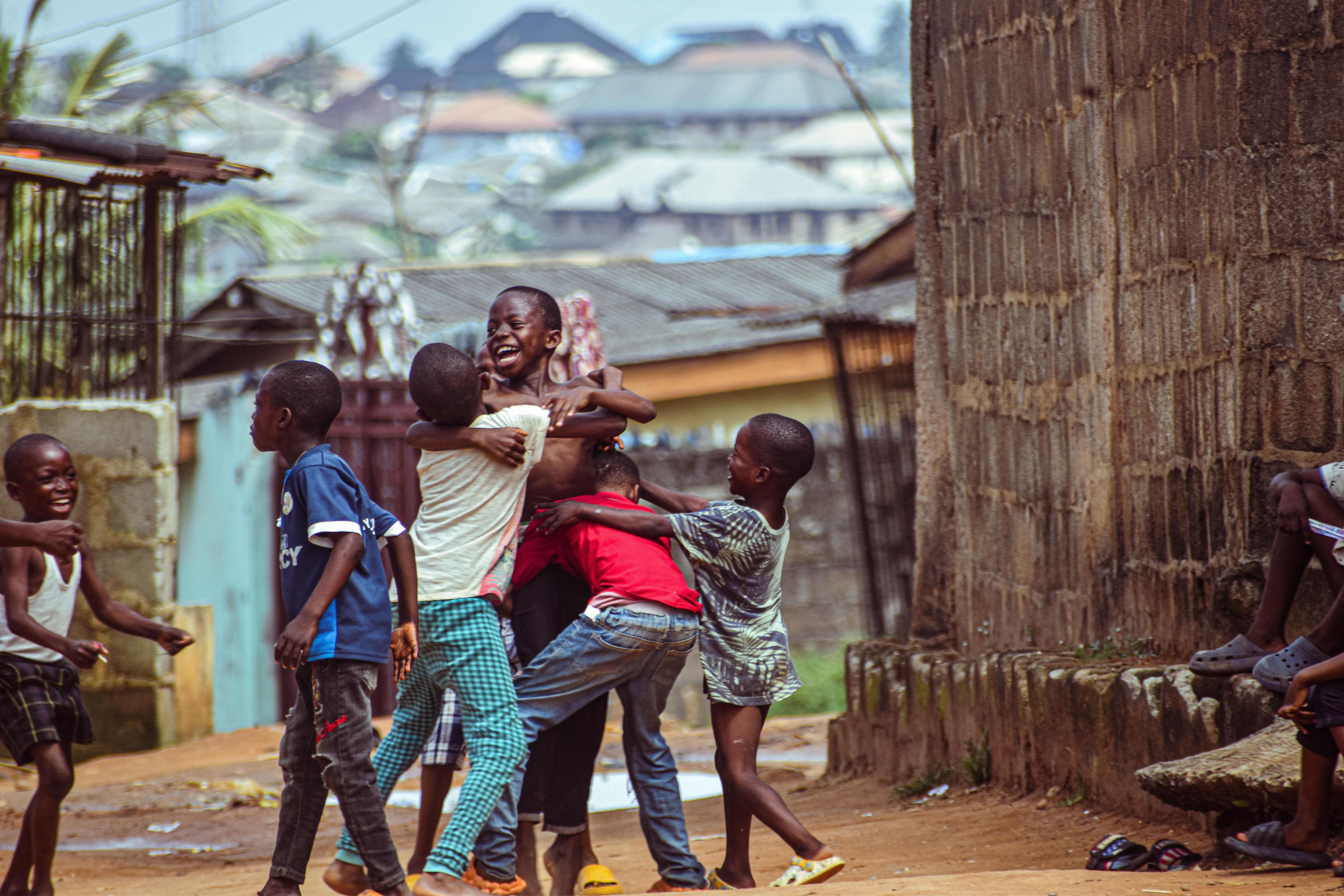 Joyful Children Playing in Urban Street Scene · Free Stock Photo