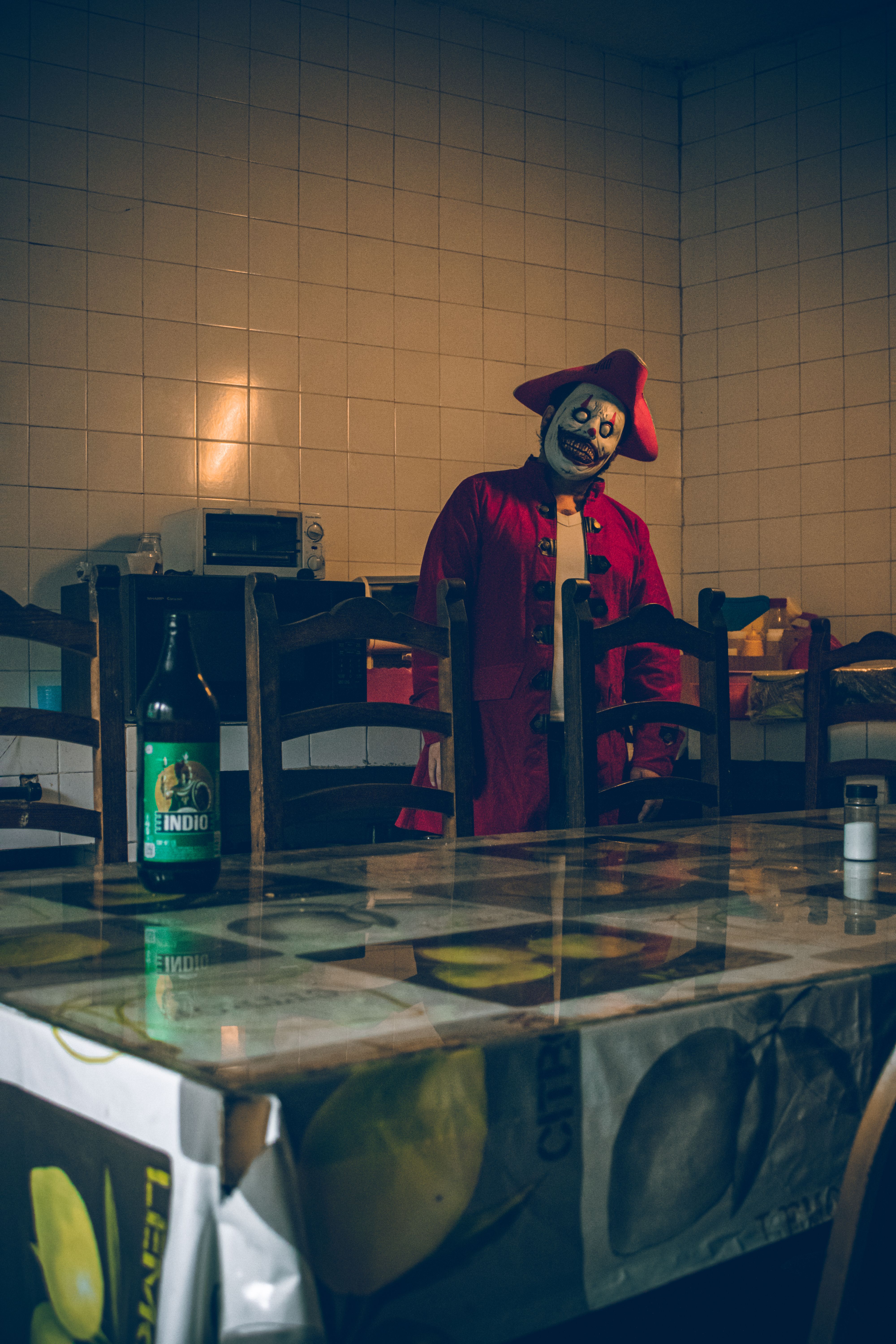 Creepy Clown Cosplay in a Dimly Lit Room · Free Stock Photo