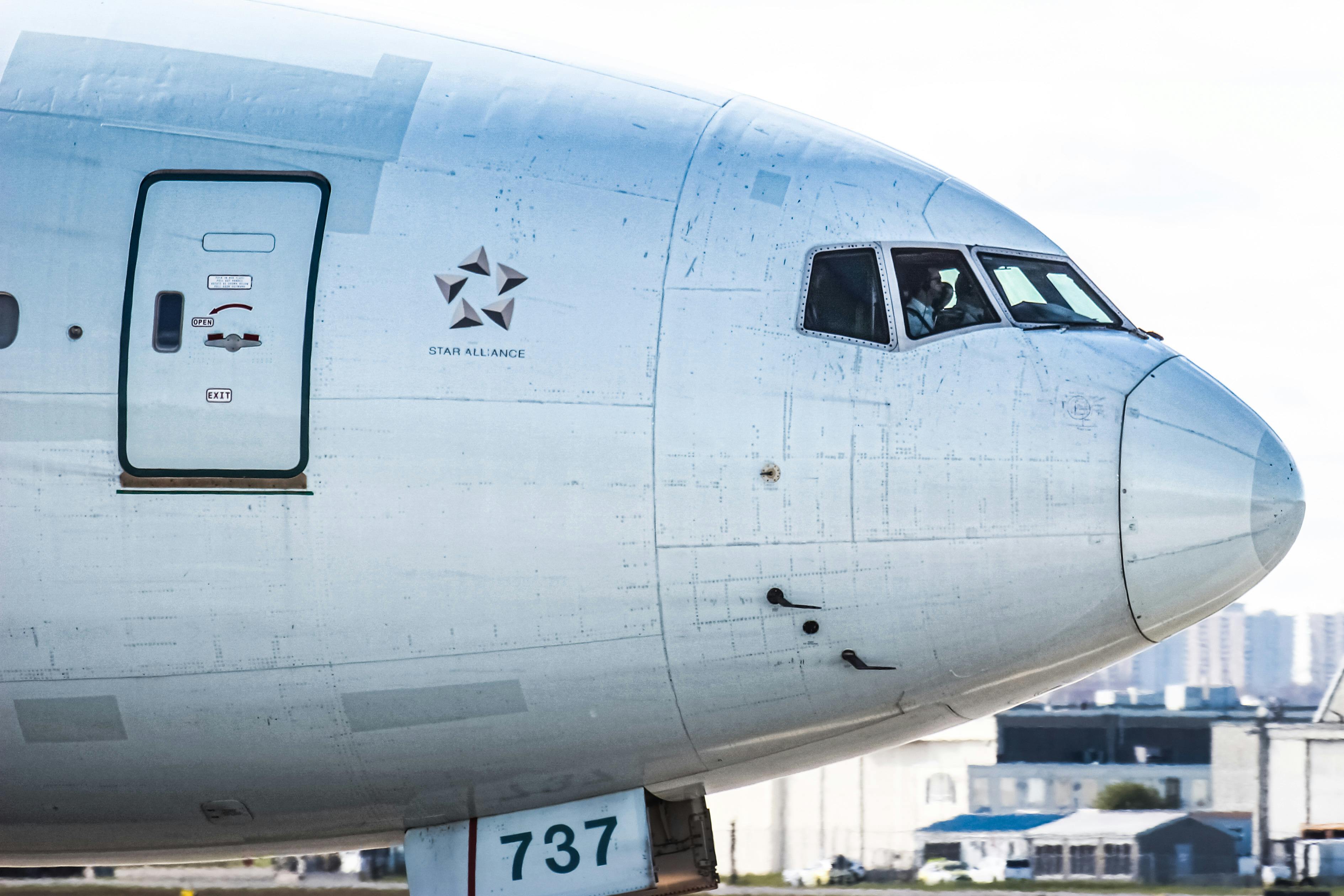 Close-up of Airplane Cockpit with Pilot Visible · Free Stock Photo