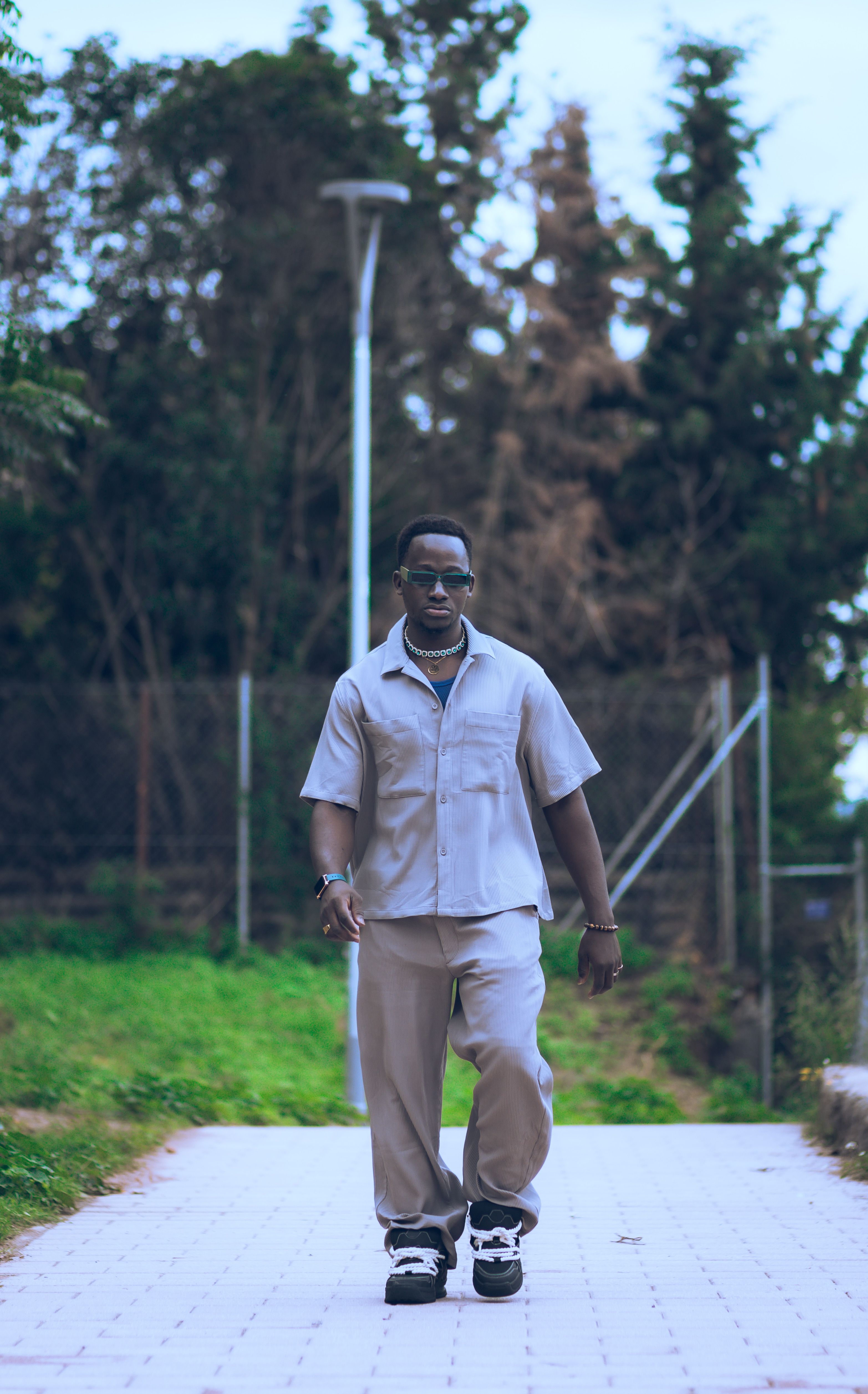 Casual Stroll: Man in Urban Park Setting · Free Stock Photo