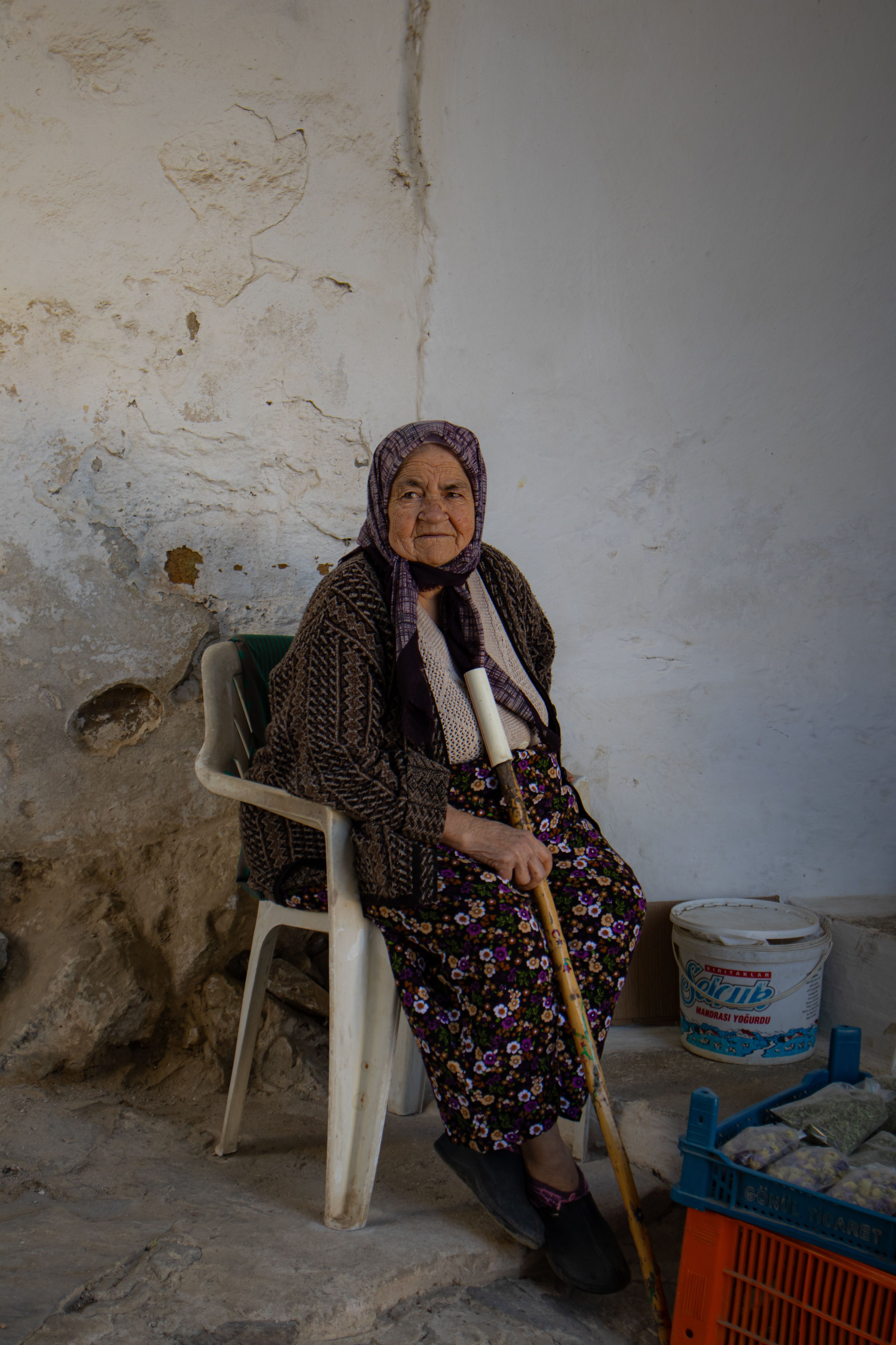 Elderly Woman in Traditional Turkish Setting · Free Stock Photo