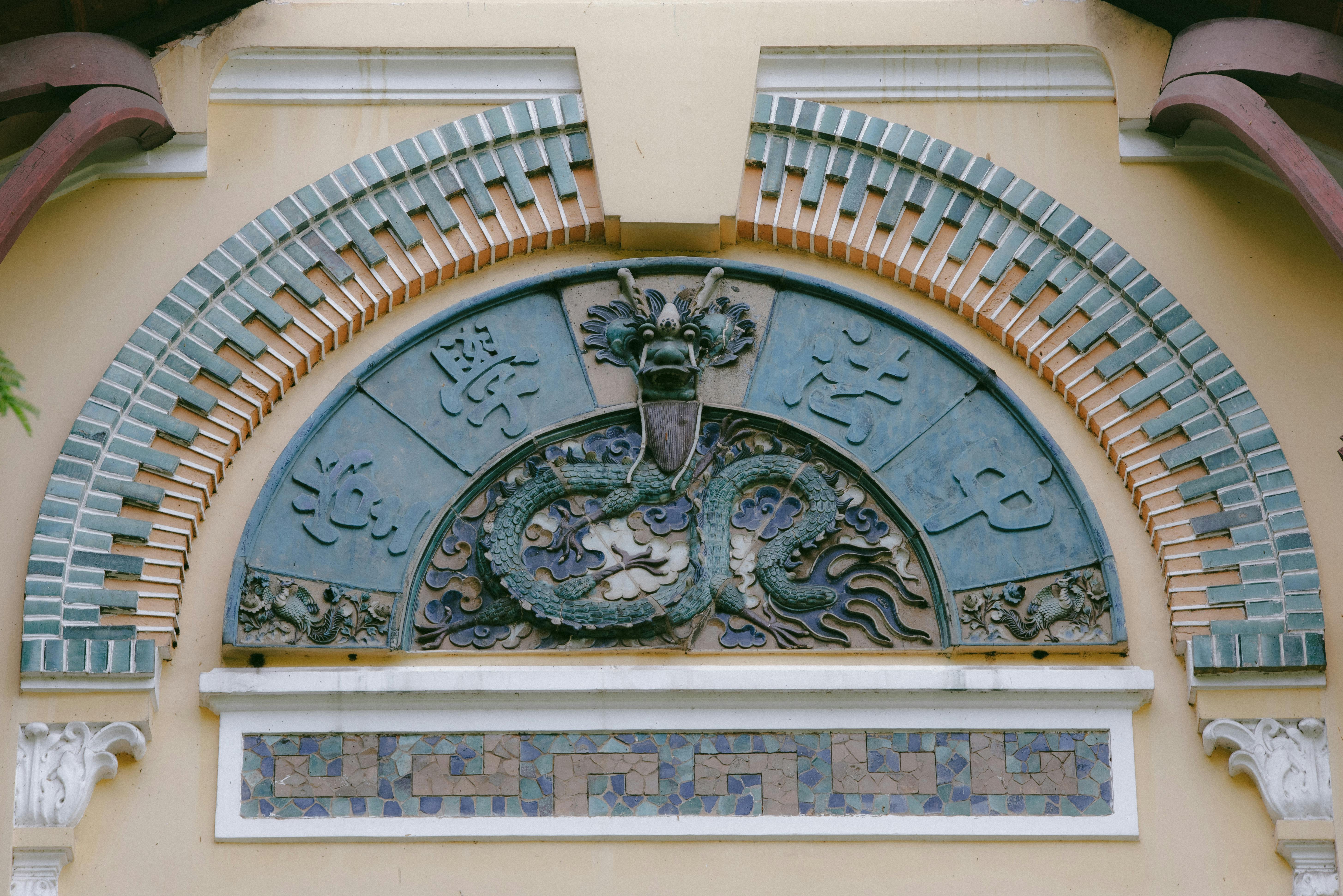 Traditional Dragon Relief on Vietnamese Building · Free Stock Photo