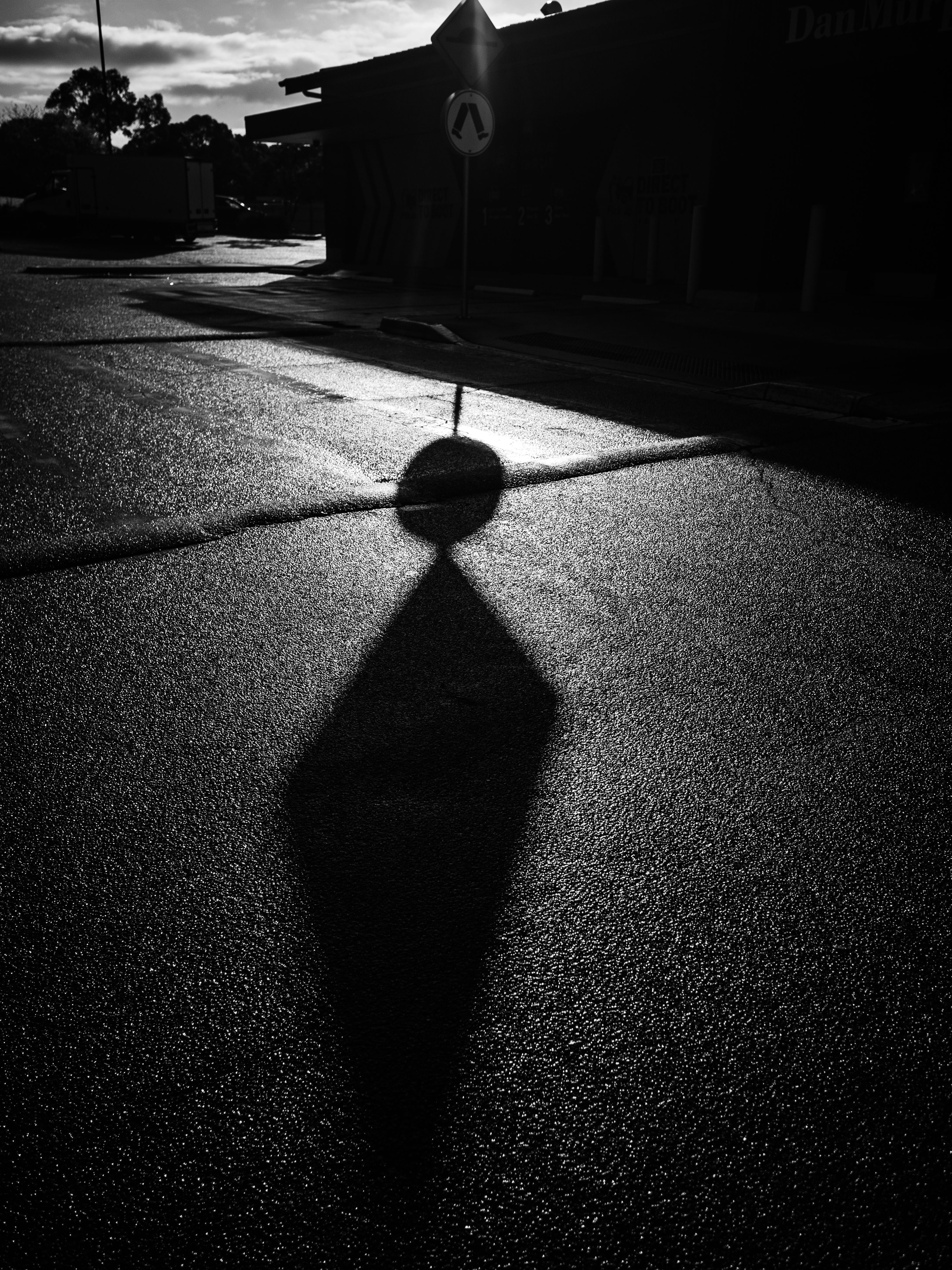Dramatic Black and White Street Shadow Scene · Free Stock Photo
