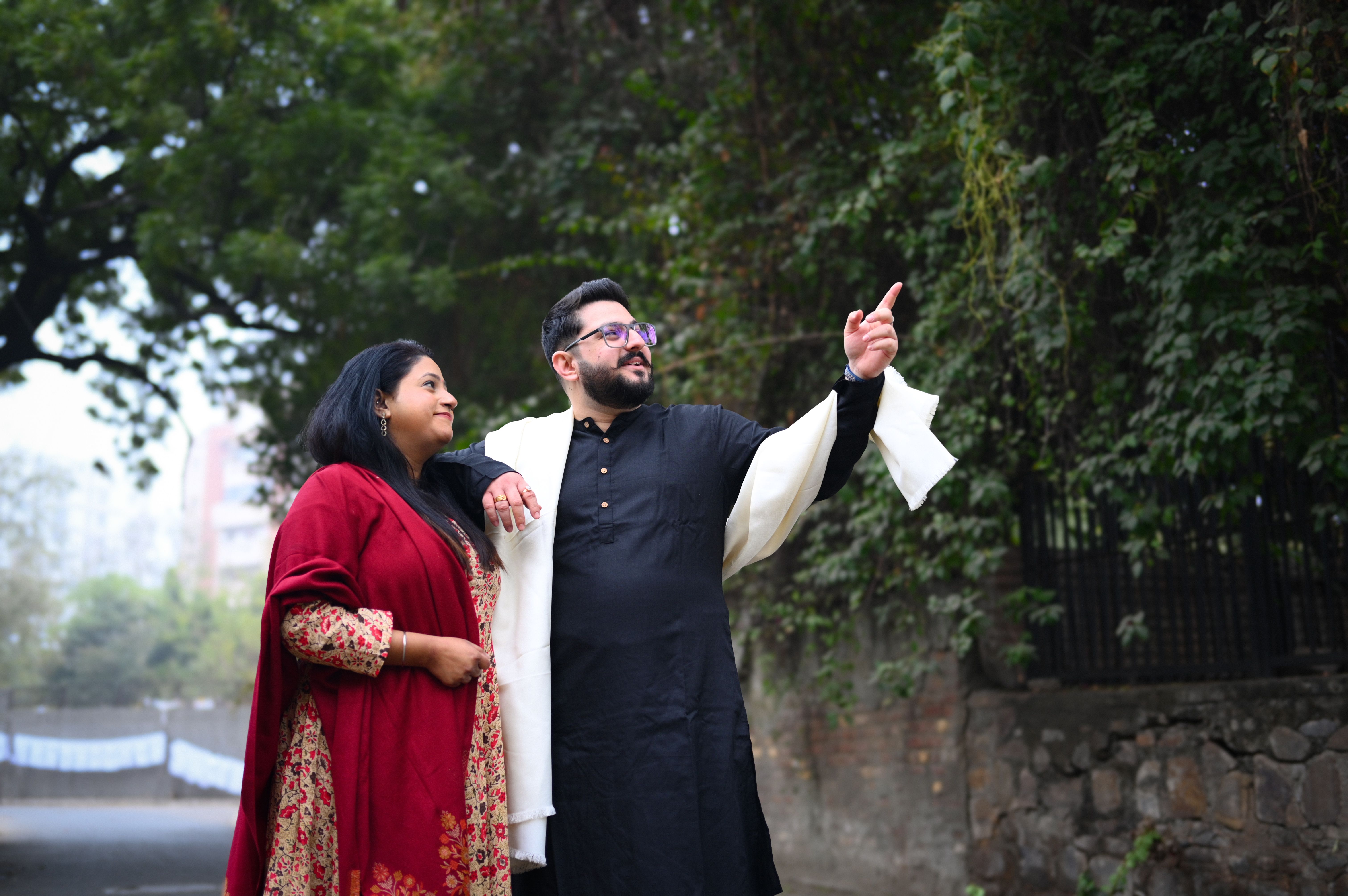Couple Enjoying Nature Walk in Traditional Attire · Free Stock Photo