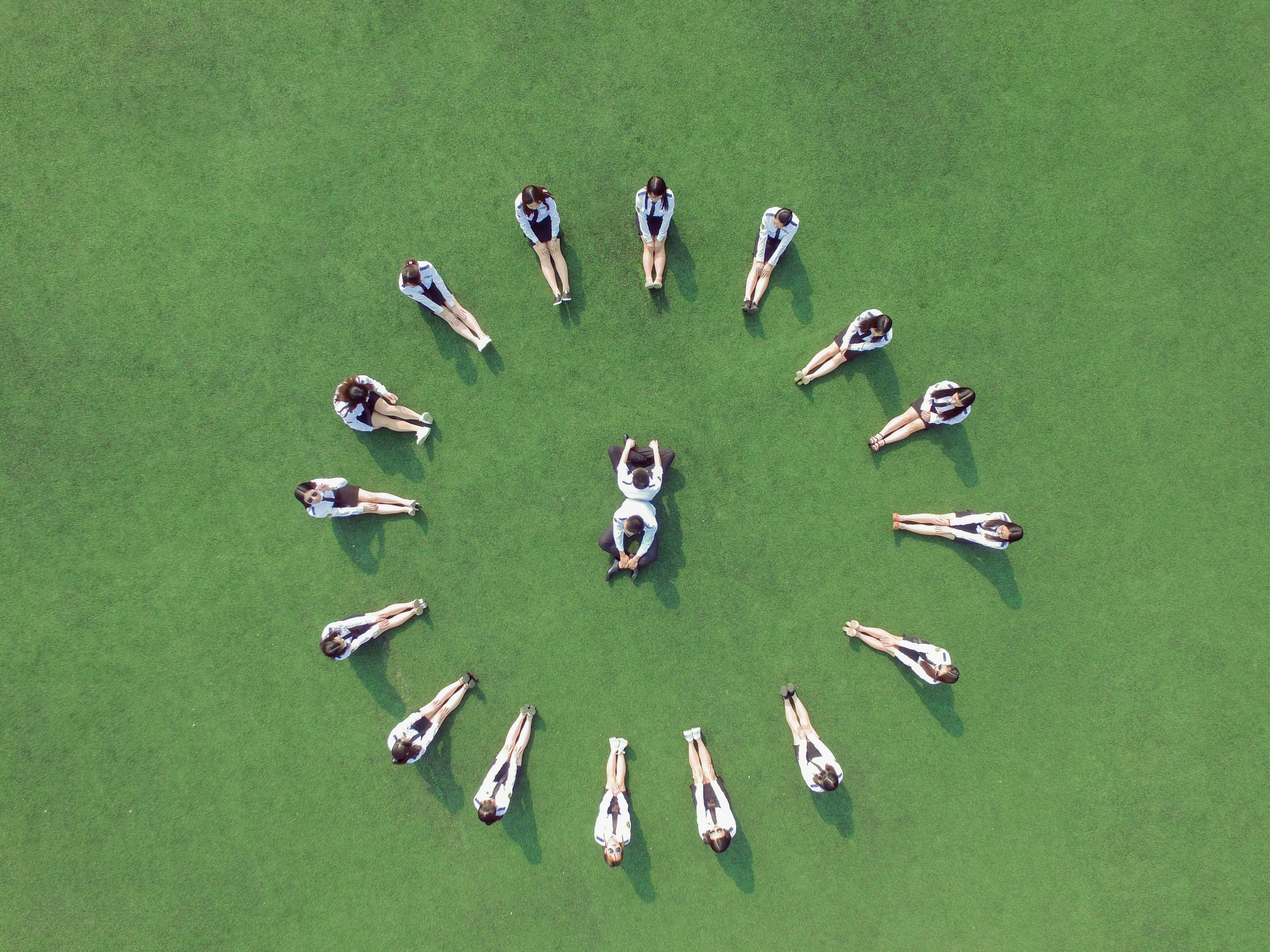 Aerial View of Students Forming Circle on Field · Free Stock Photo