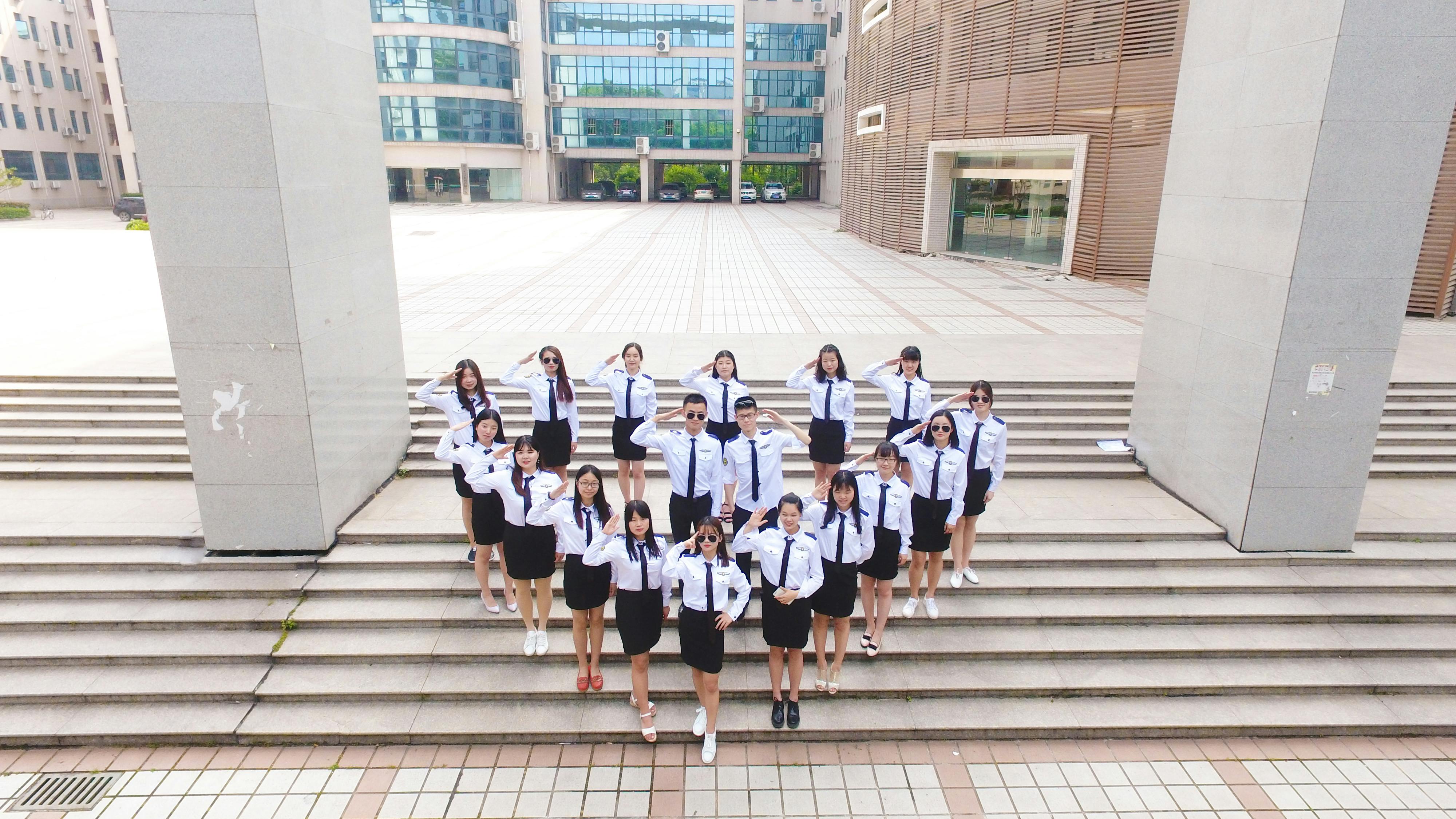 Aerial View of Students in Uniform Forming a Group Pose · Free Stock Photo