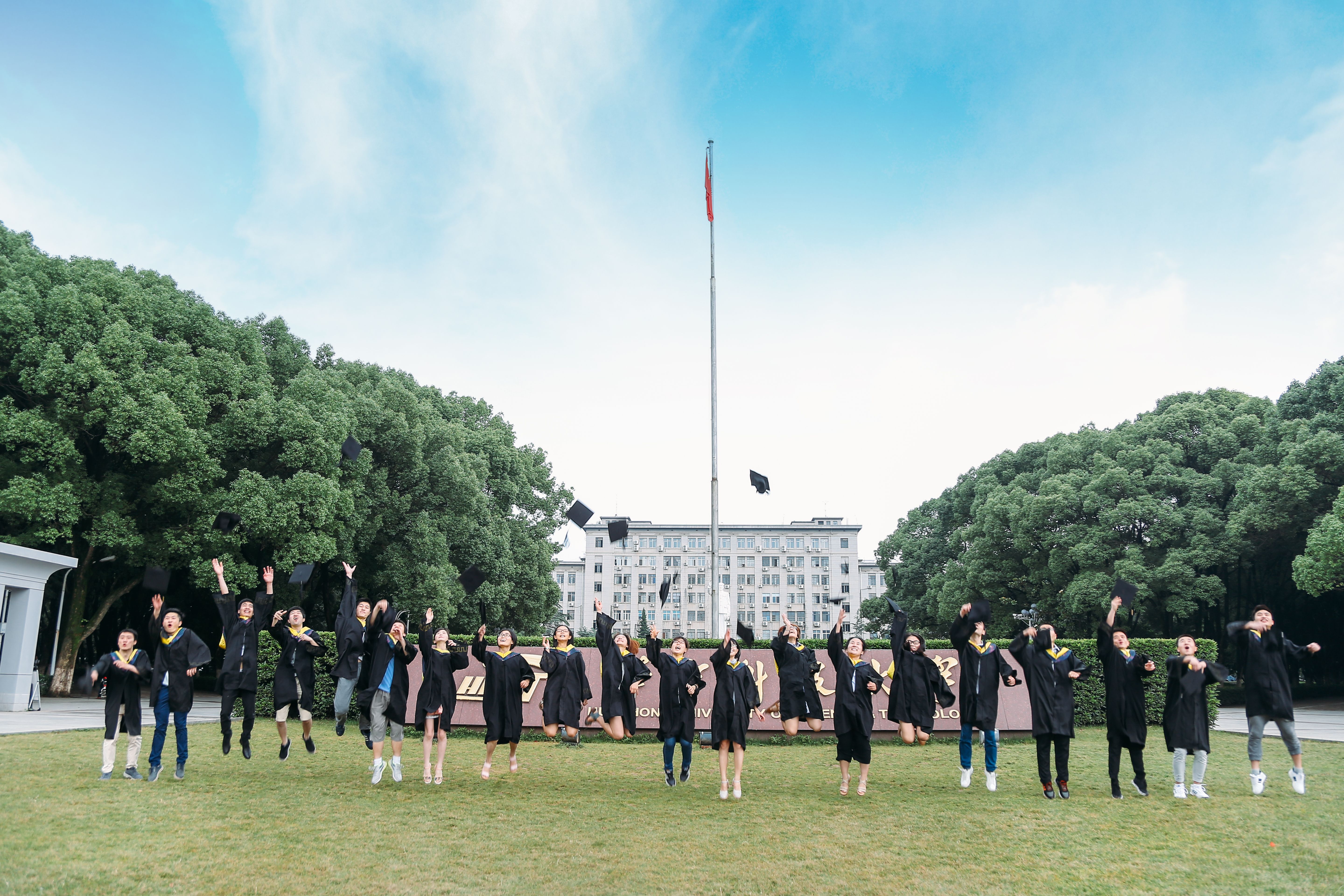 Joyful Graduation Celebration Outdoors · Free Stock Photo