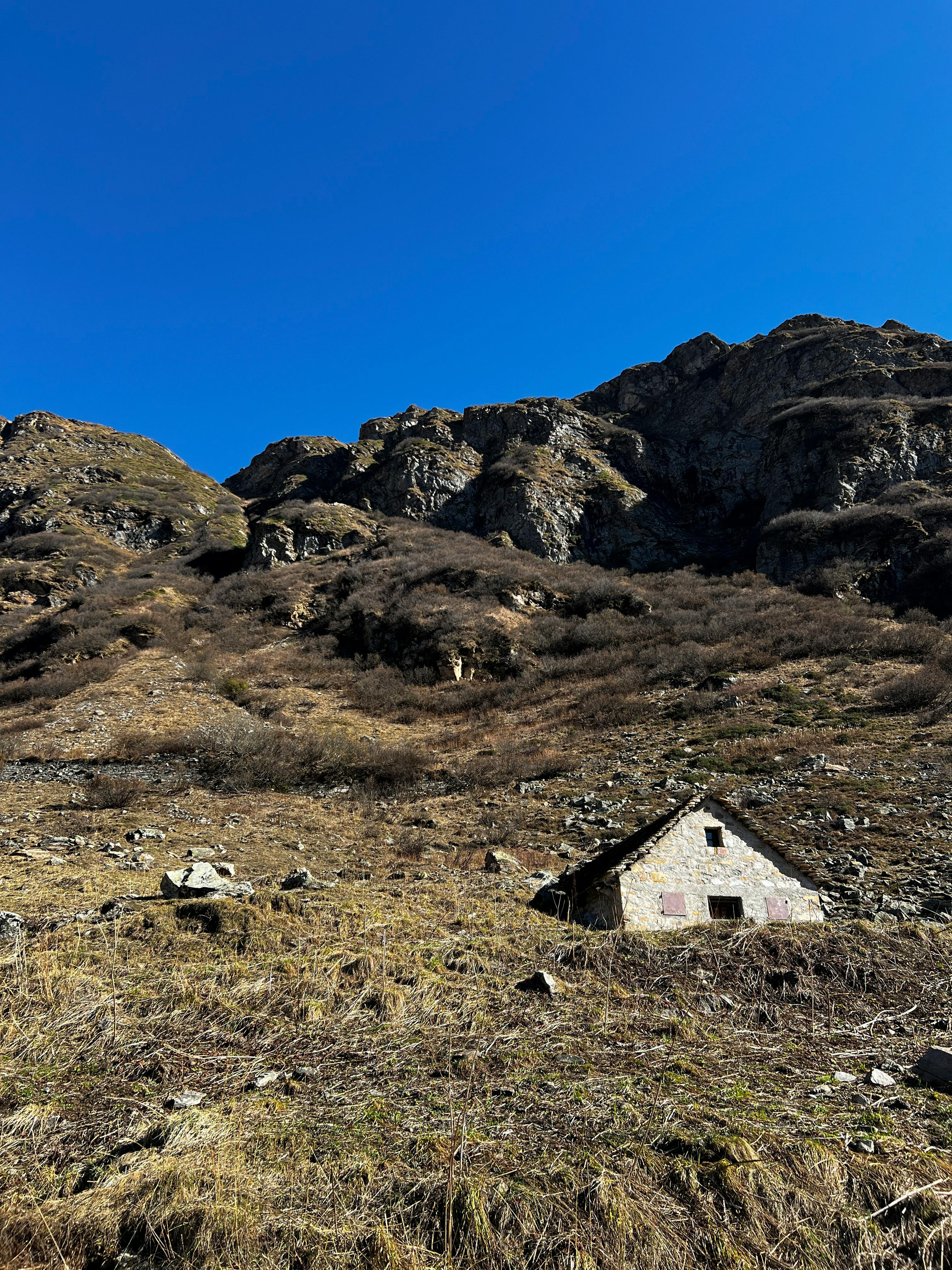 Isolated Mountain Hut in Rugged Terrain · Free Stock Photo