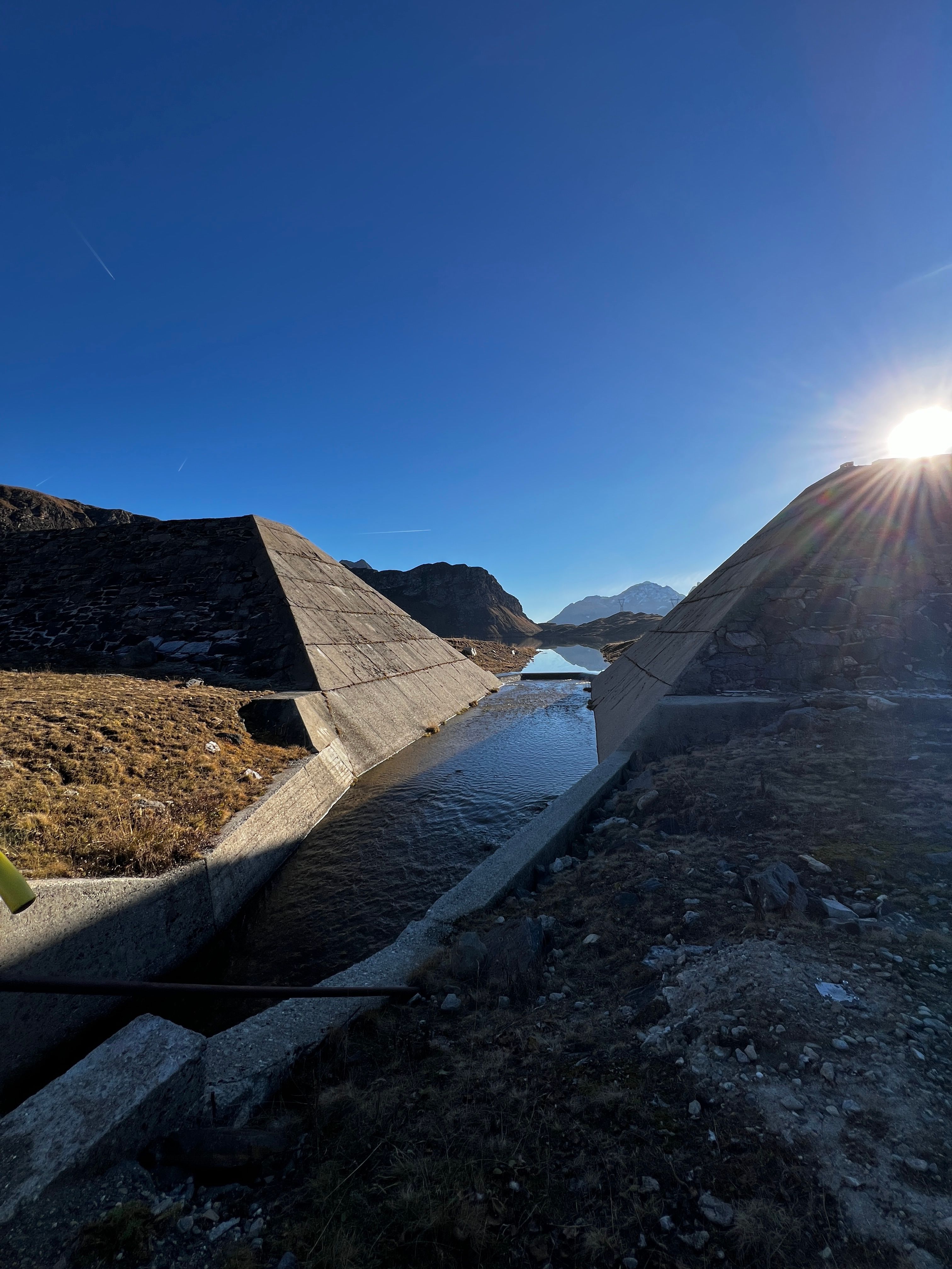 Mountain Waterway with Concrete Structures · Free Stock Photo