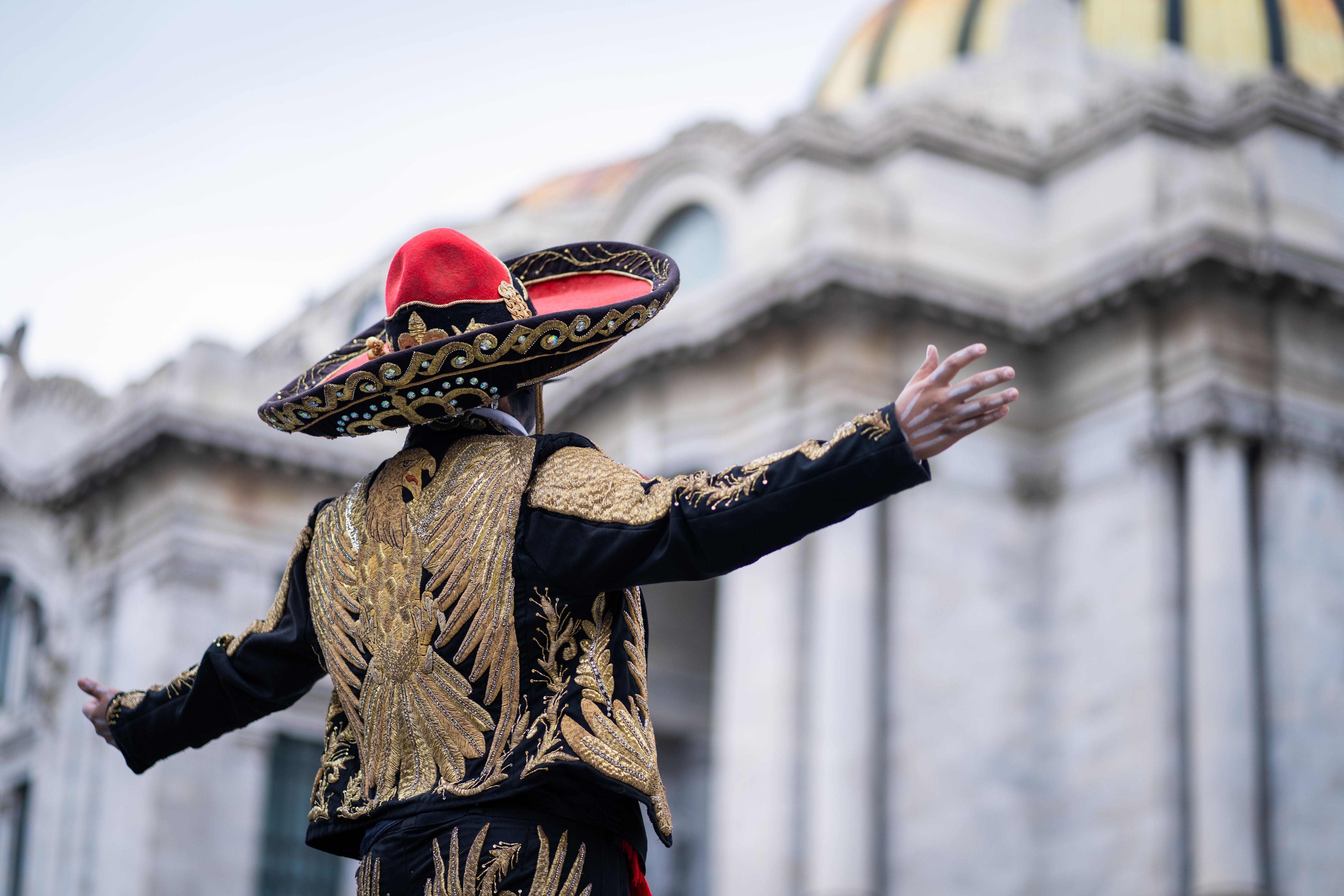 Traditional Mexican Costume in Front of Iconic Landmark · Free Stock Photo
