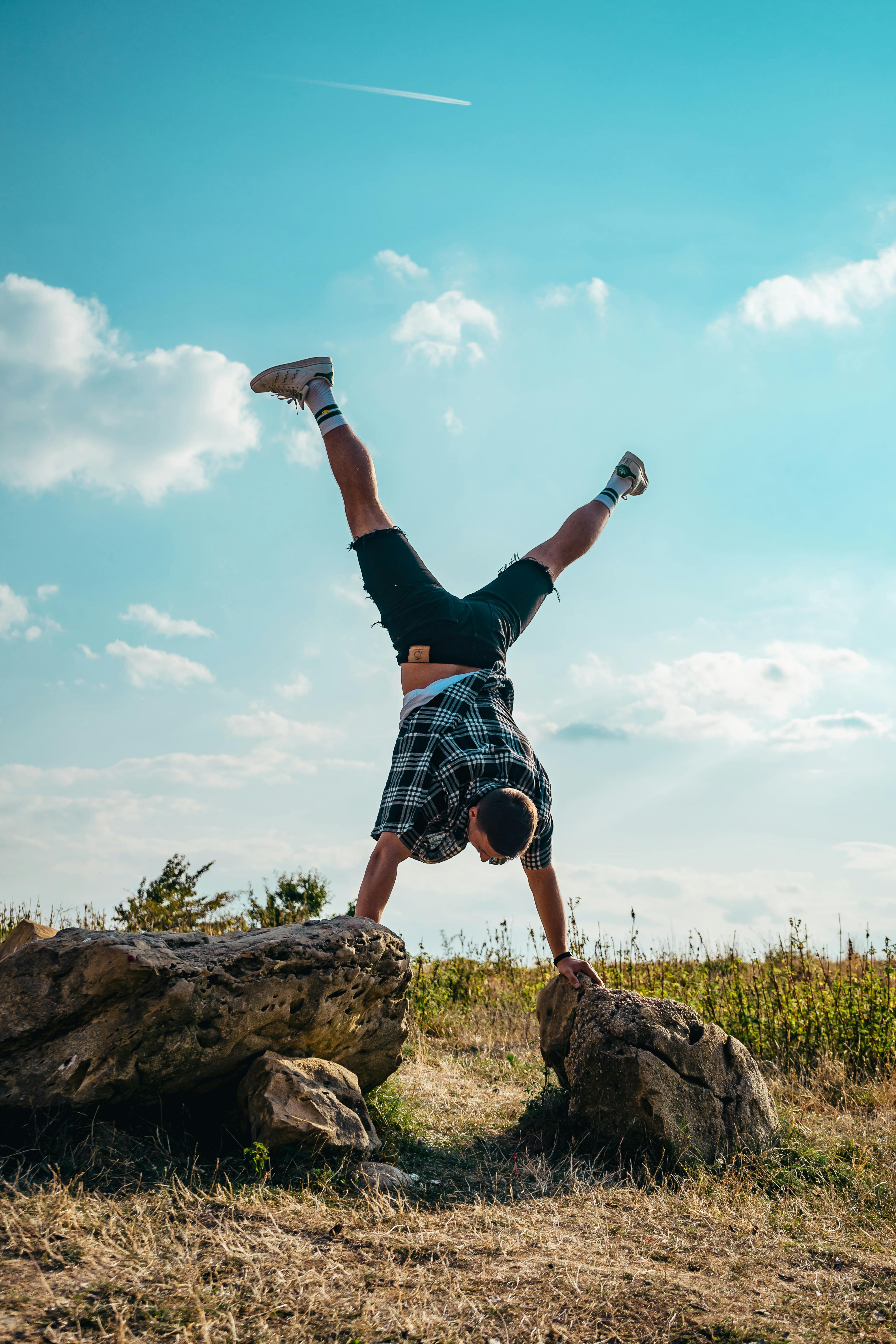 Man Balancing on Stones · Free Stock Photo