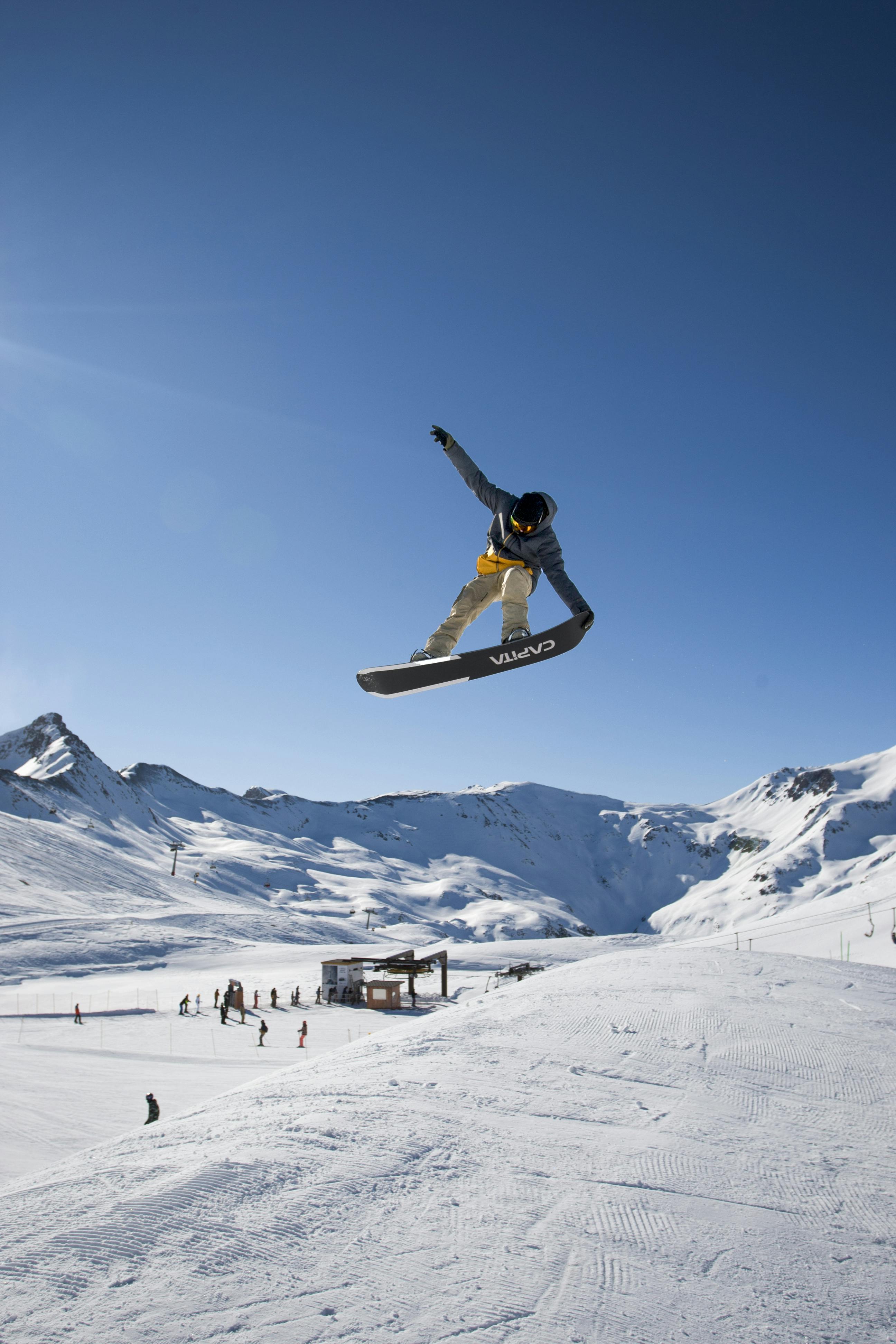 Snowboarder in Mid-Air Trick at Livigno · Free Stock Photo