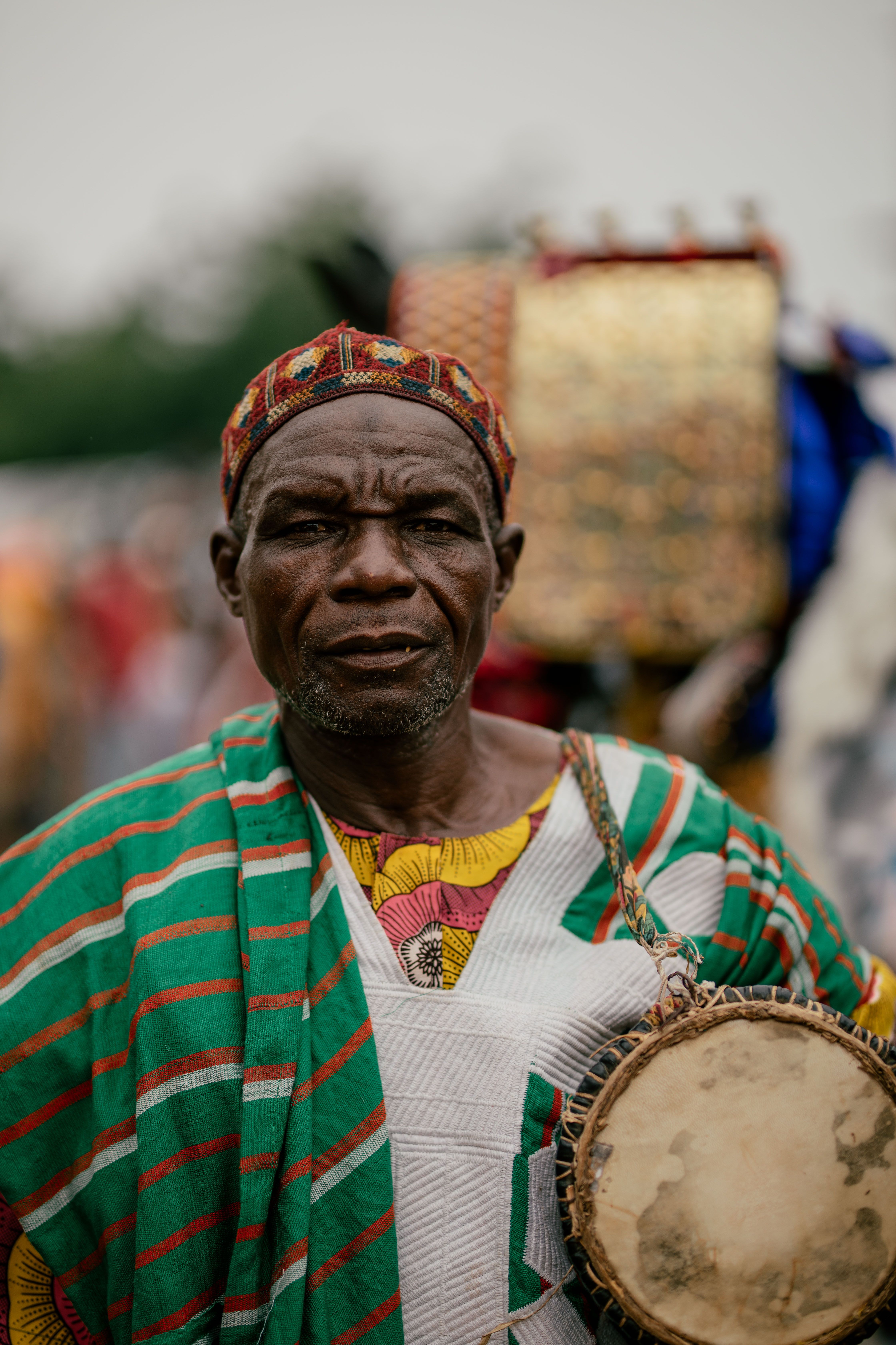African Drummer in Traditional Attire at Cultural Event · Free Stock Photo