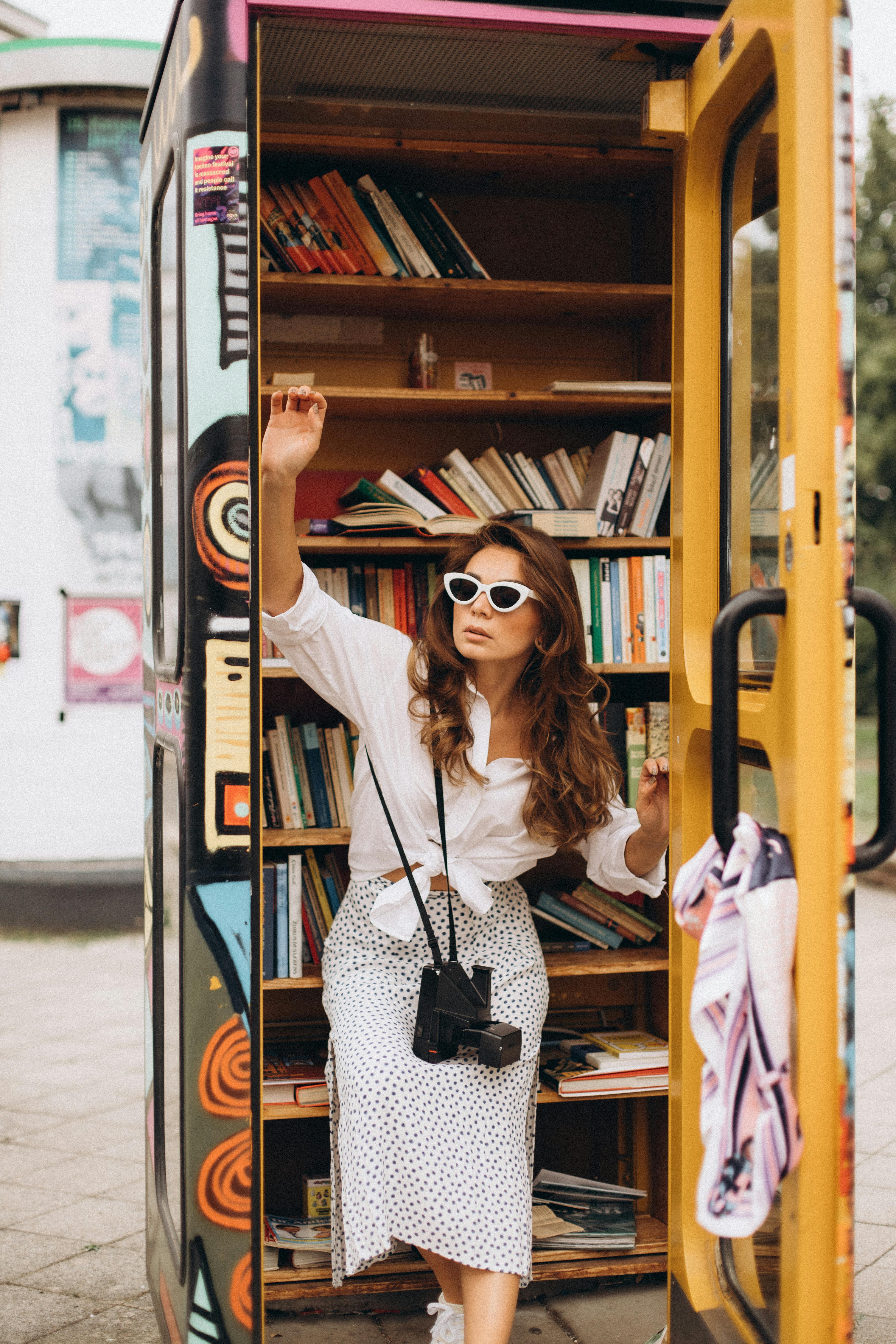 Chic Woman in Hip Urban Book Booth · Free Stock Photo