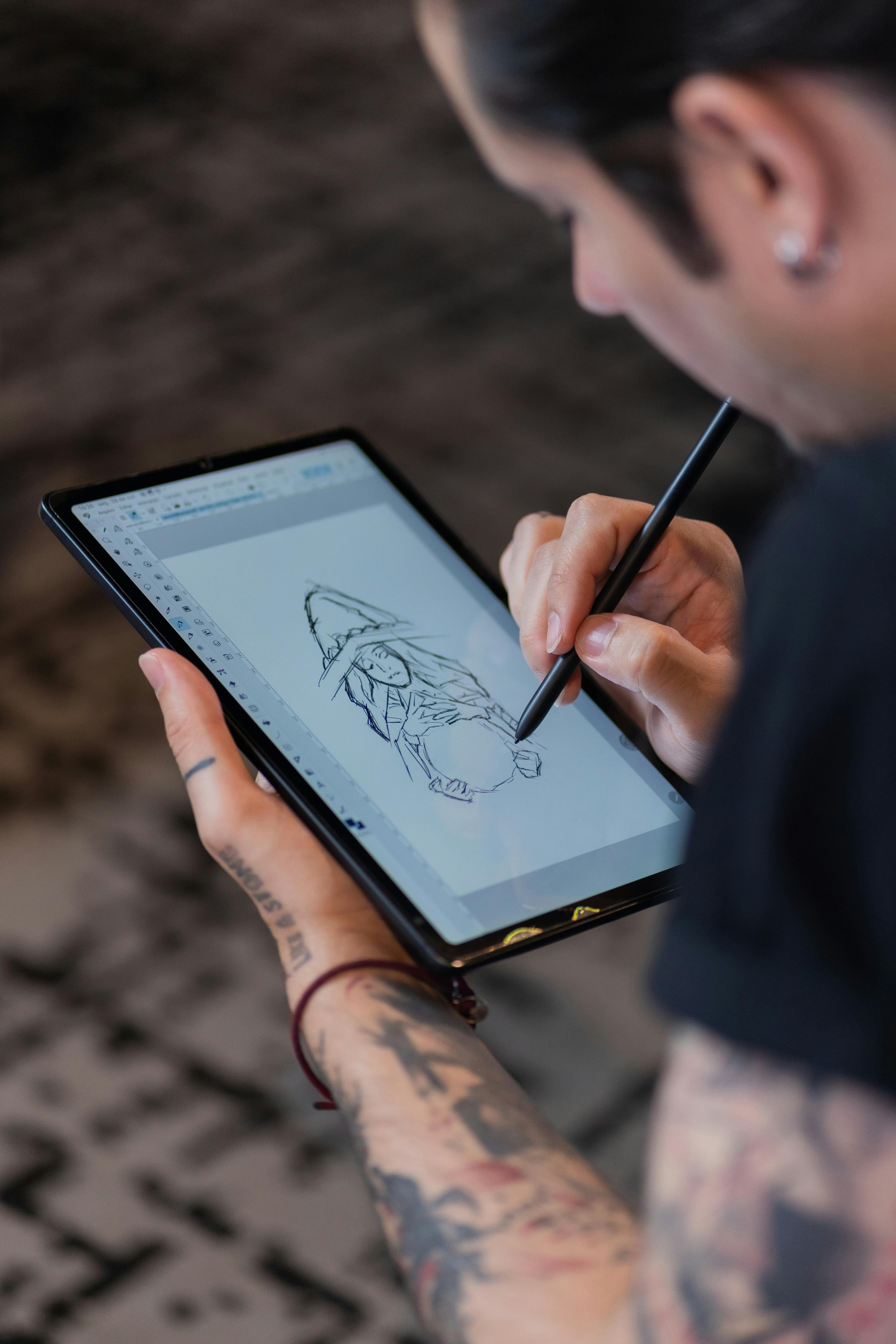Digital Artist Drawing on Tablet with Stylus · Free Stock Photo