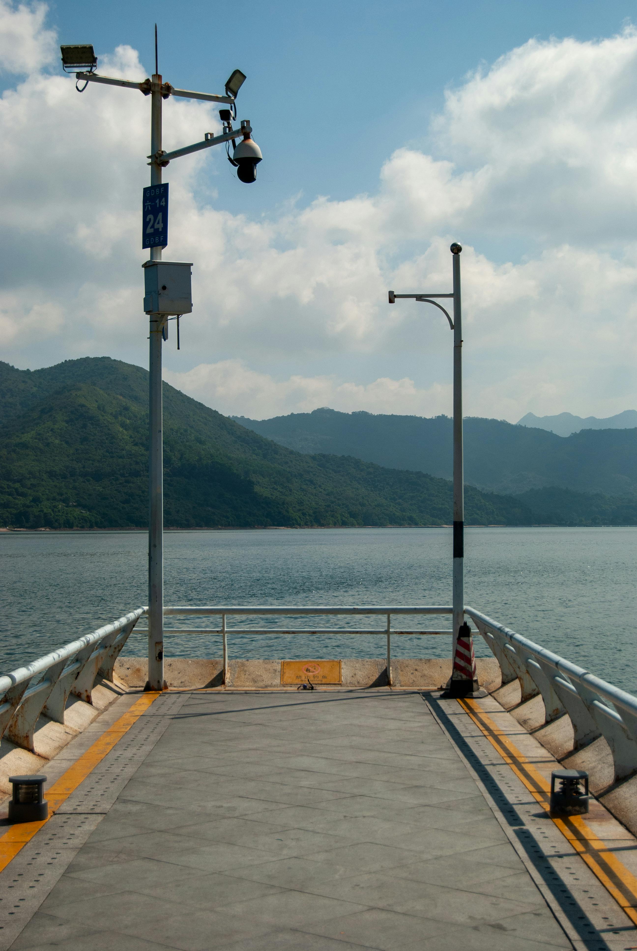 Scenic Pier Overlooking Mountainous Lake View · Free Stock Photo