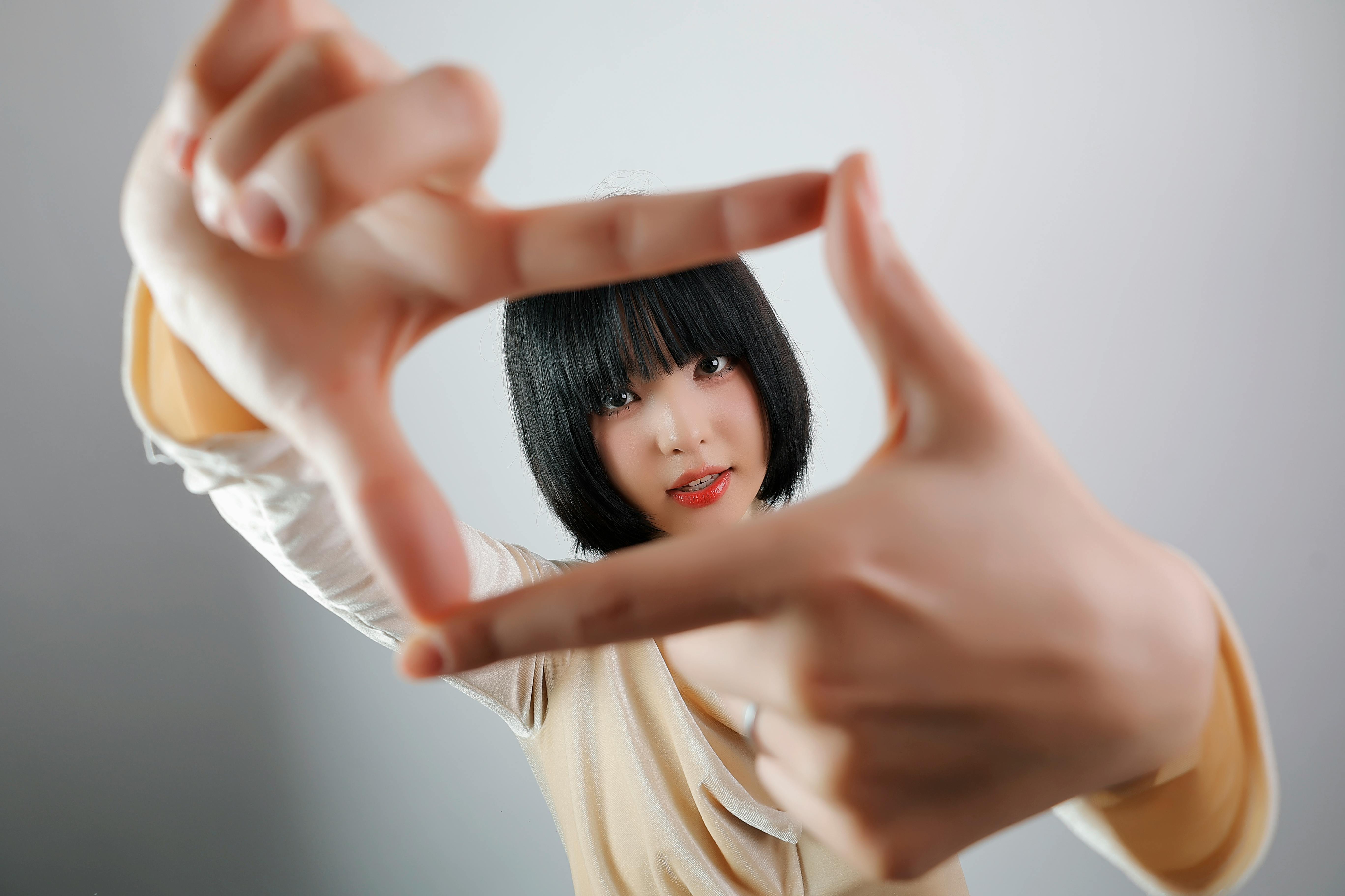 Creative Portrait Framing with Hands · Free Stock Photo