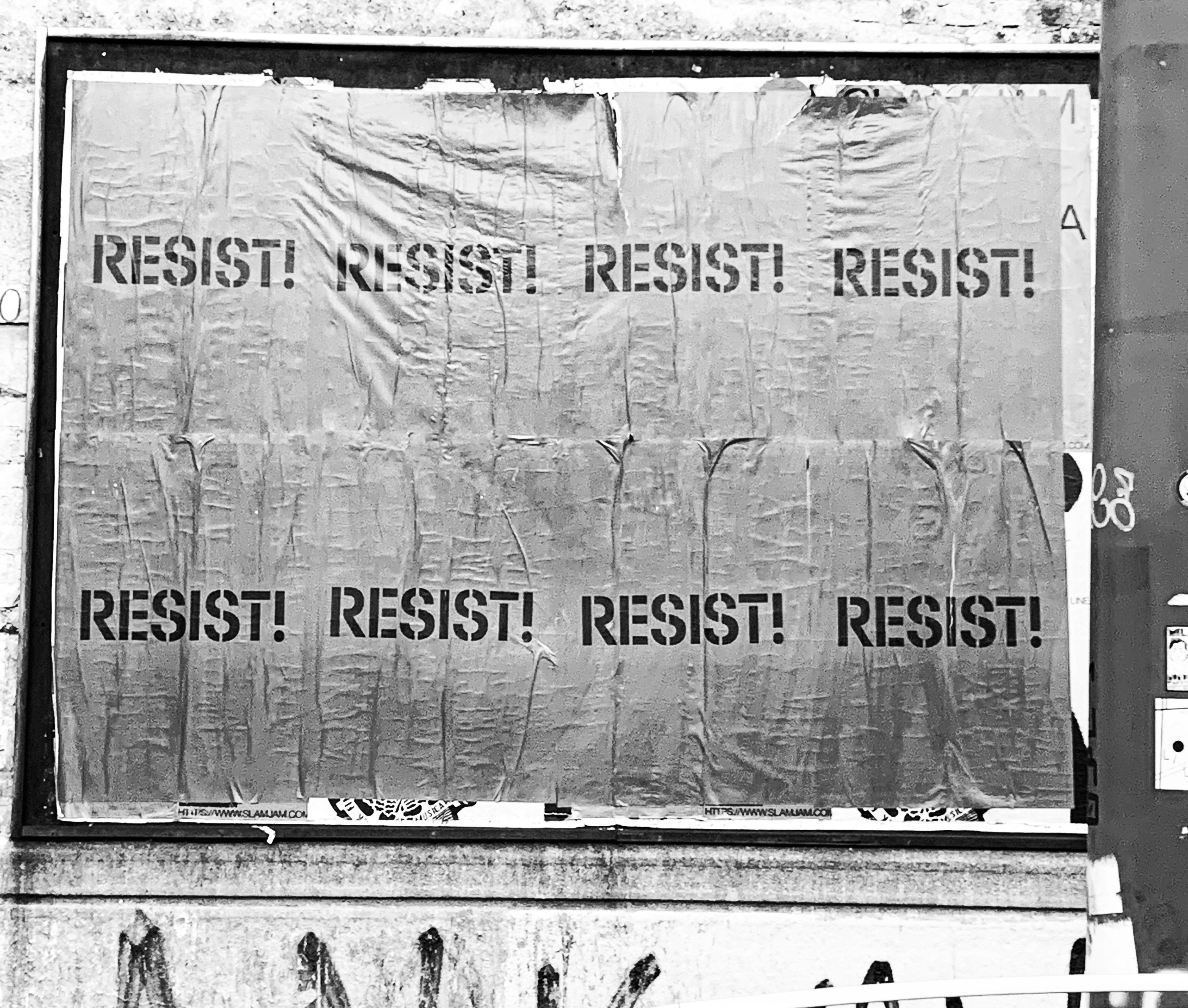 Urban Street Art with 'Resist' Posters · Free Stock Photo