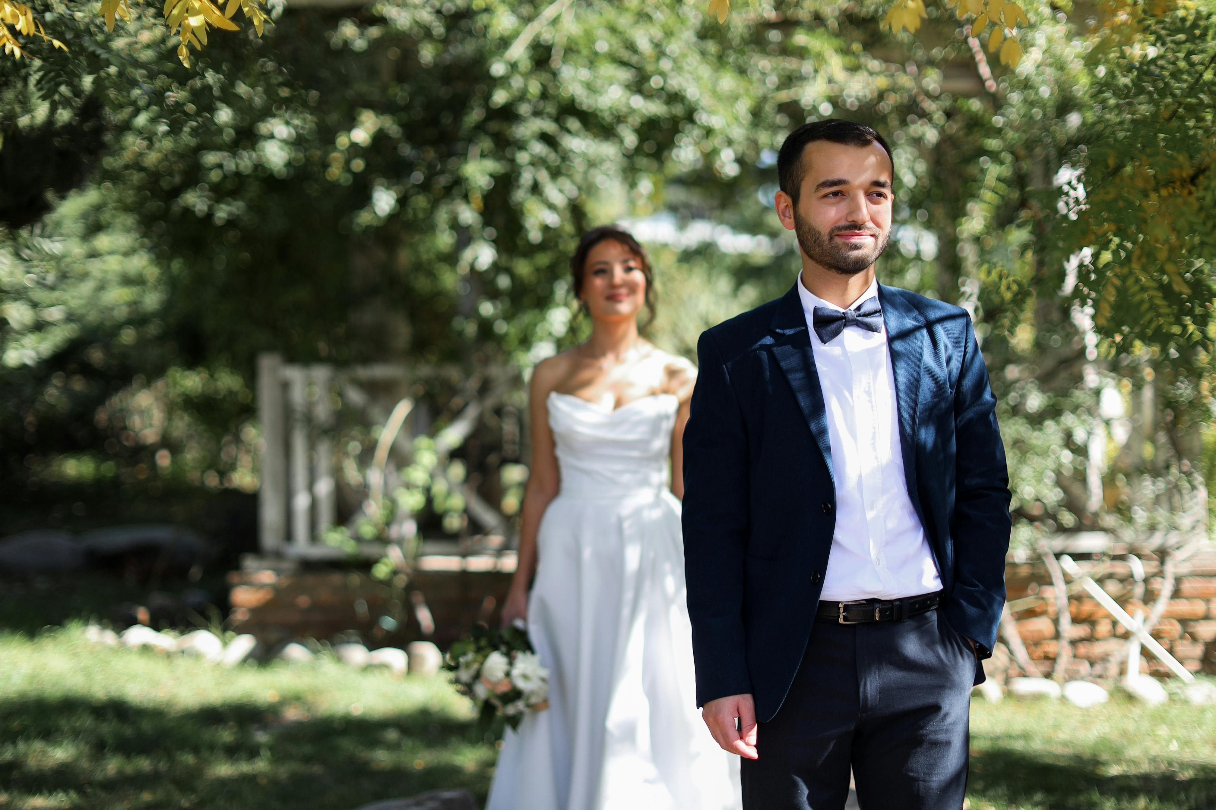 Joyful Outdoor Wedding Portrait with Bride and Groom · Free Stock Photo