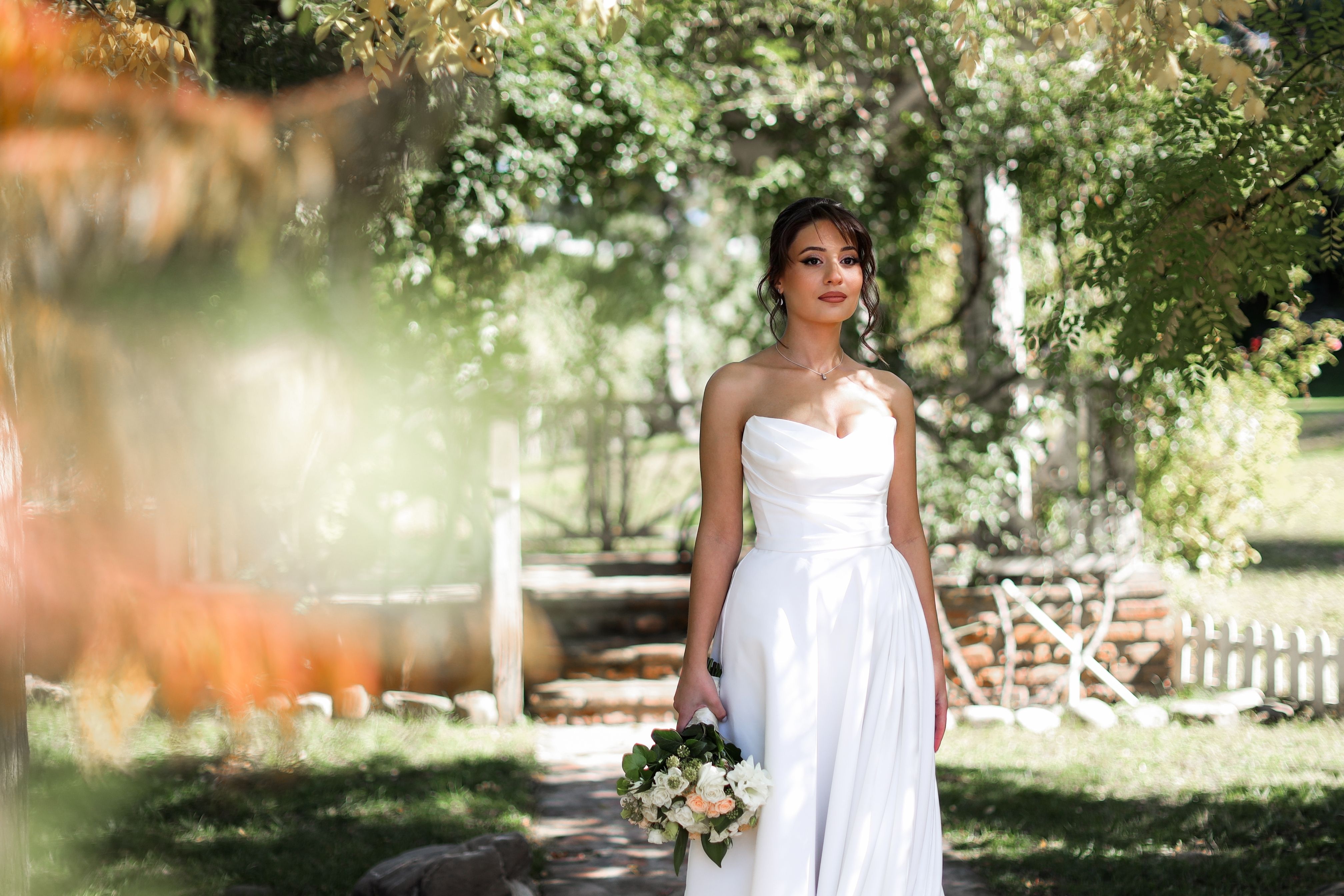 Elegant Bride in Outdoor Garden Setting · Free Stock Photo