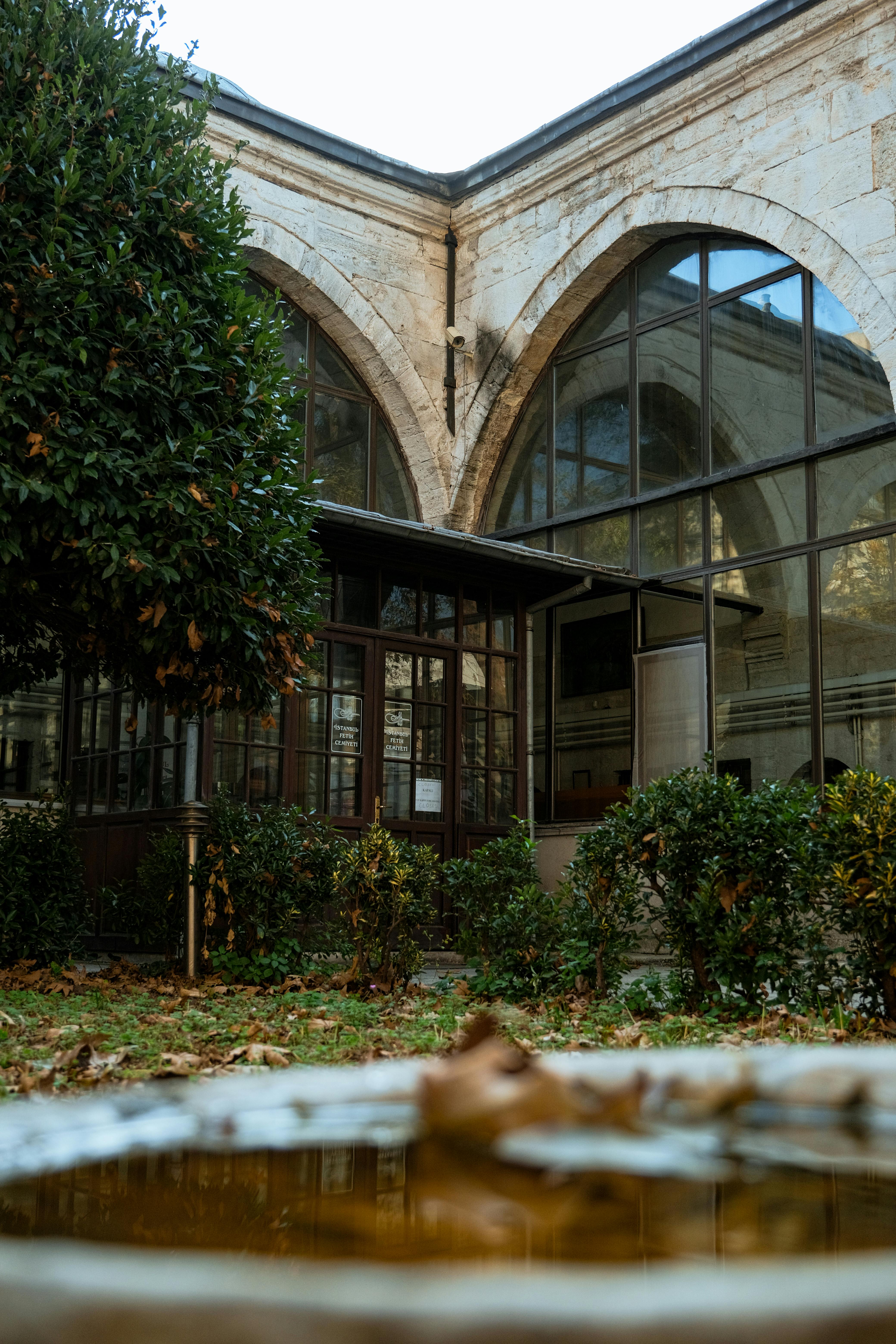 Historic Stone Building with Arched Windows · Free Stock Photo
