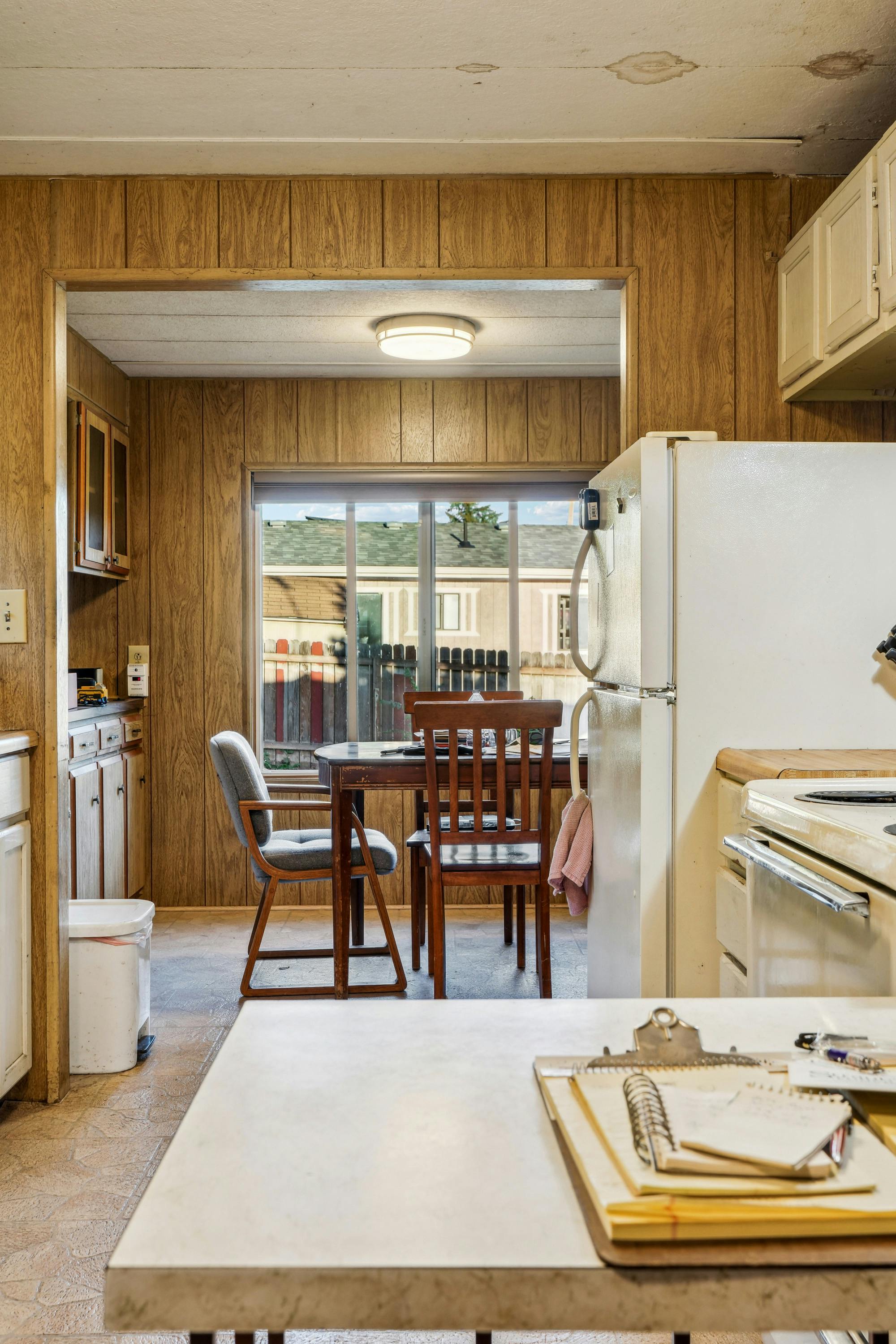 Cozy Retro Kitchen with Dining Area and Natural Light · Free Stock Photo