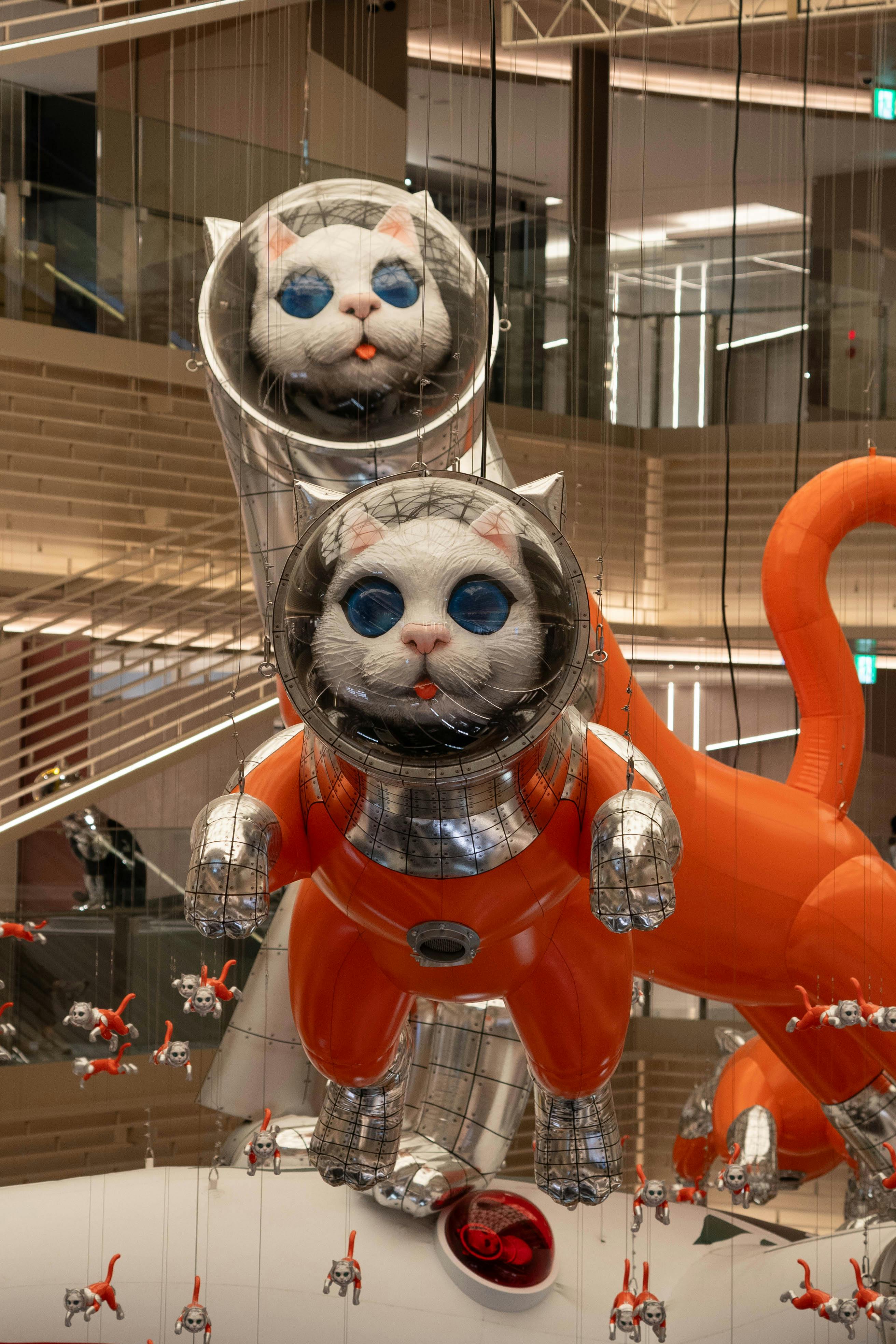 Giant Inflatable Cat Astronauts in Mall Installation · Free Stock Photo