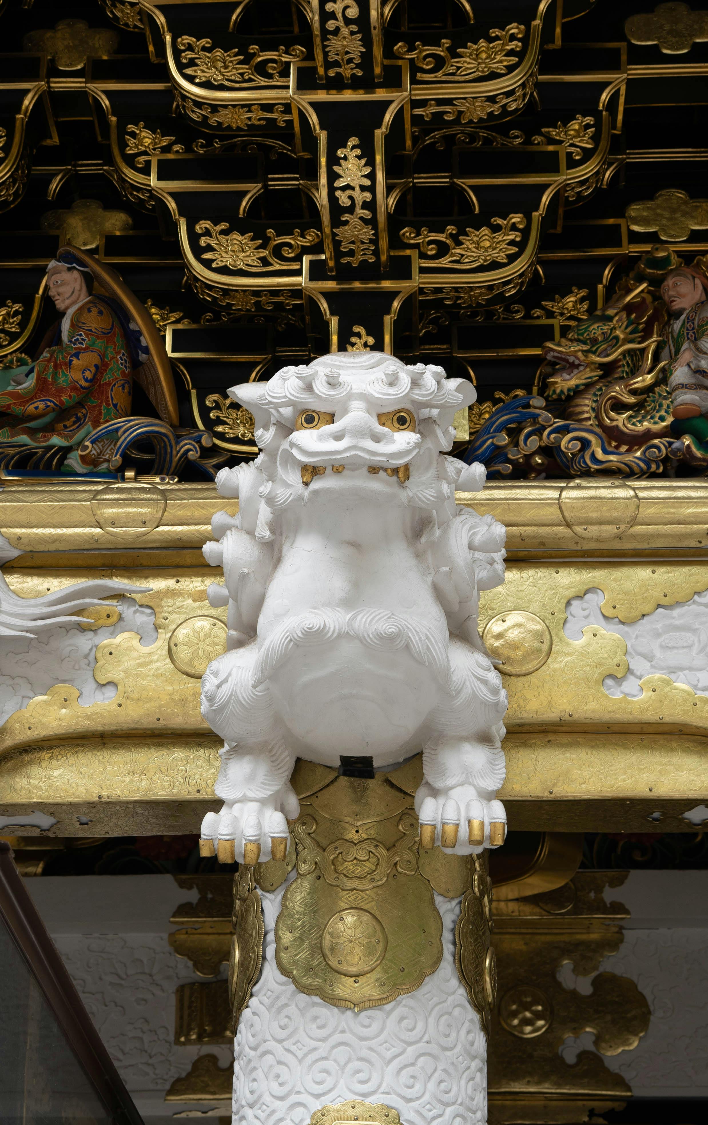 Ornate Temple Guardian Statue with Gold Details · Free Stock Photo