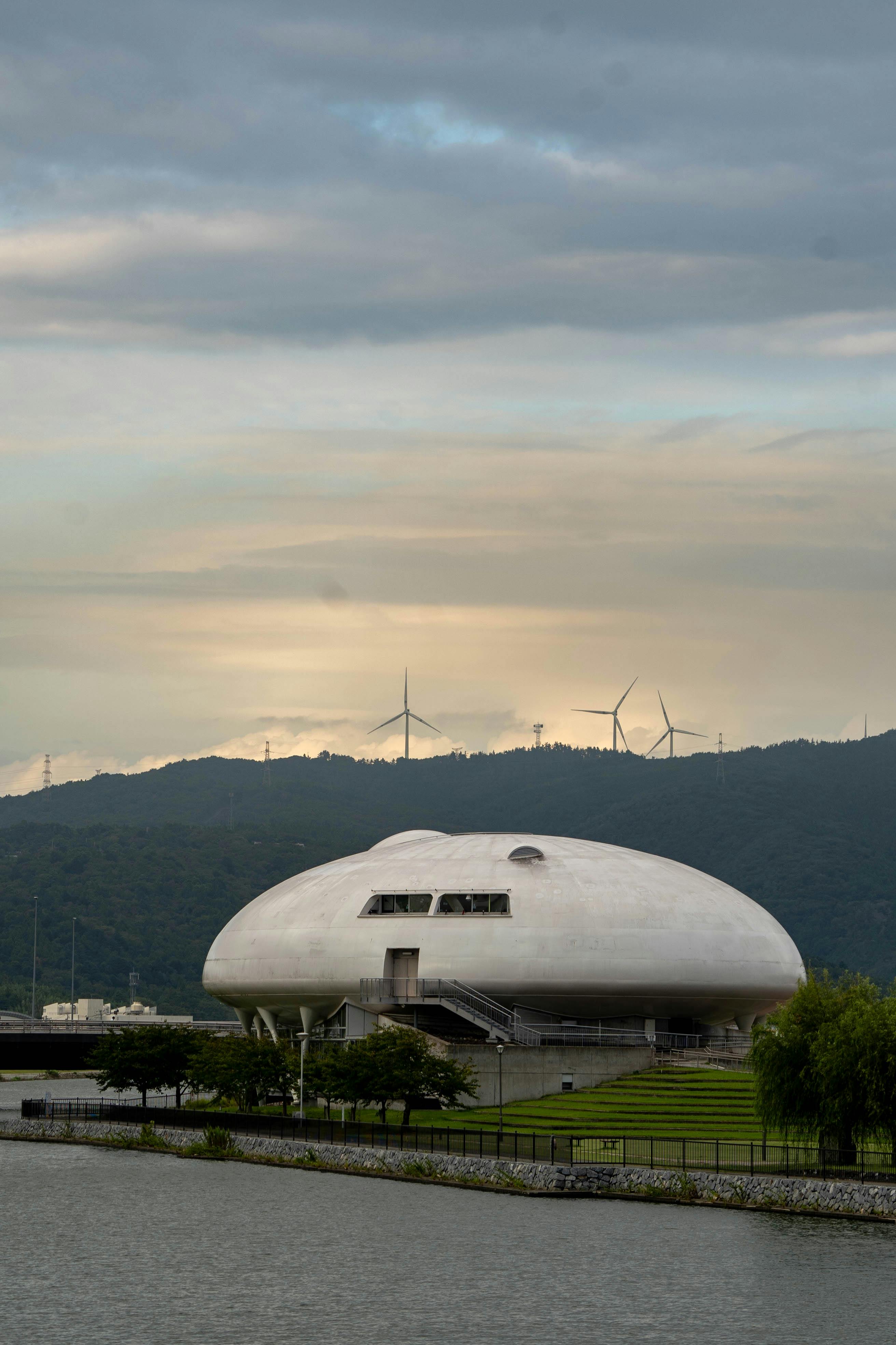 Futuristic Dome Building with Wind Turbines · Free Stock Photo