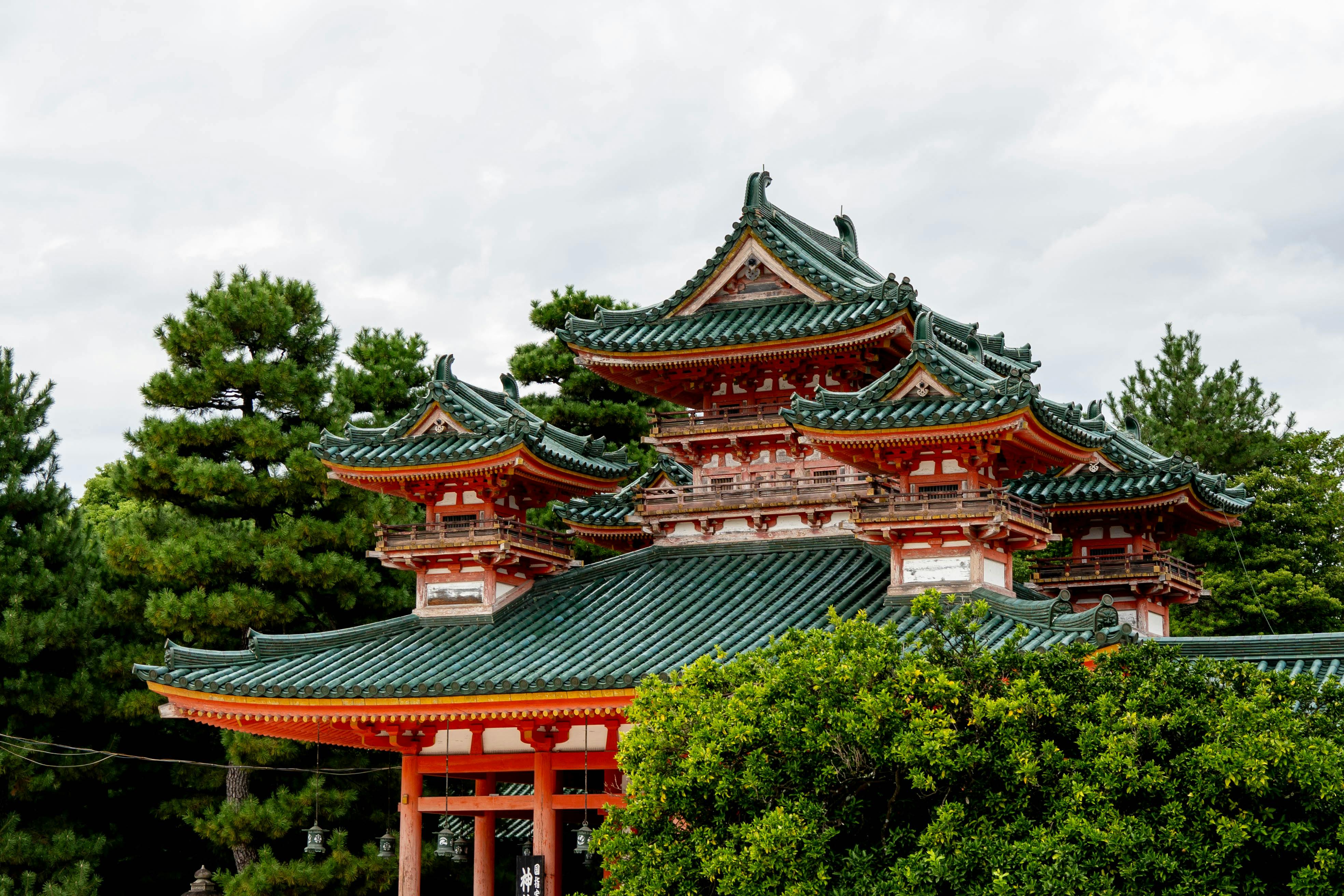 Traditional Japanese Temple Amidst Lush Greenery · Free Stock Photo