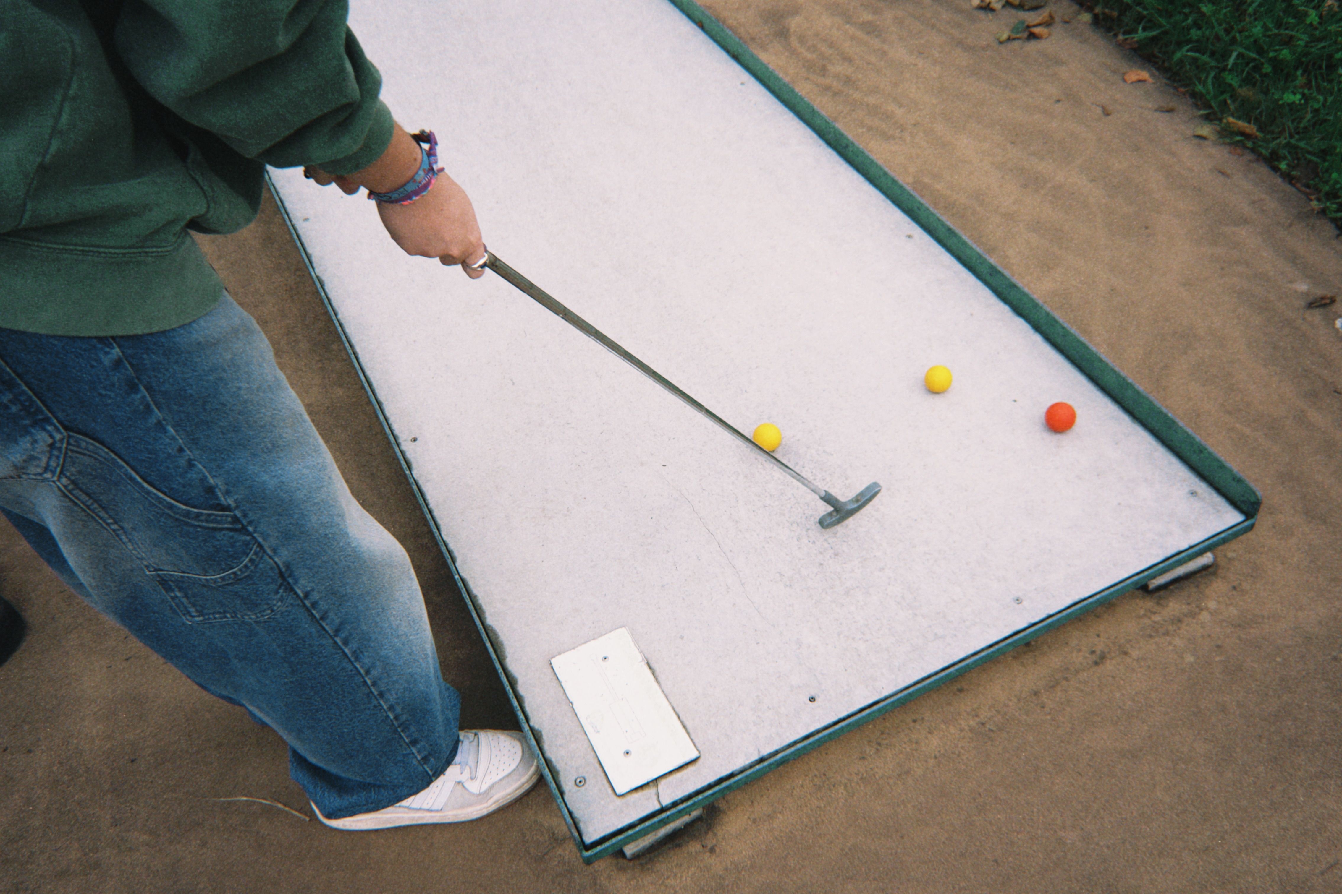 Person Playing Outdoor Mini Golf Game · Free Stock Photo