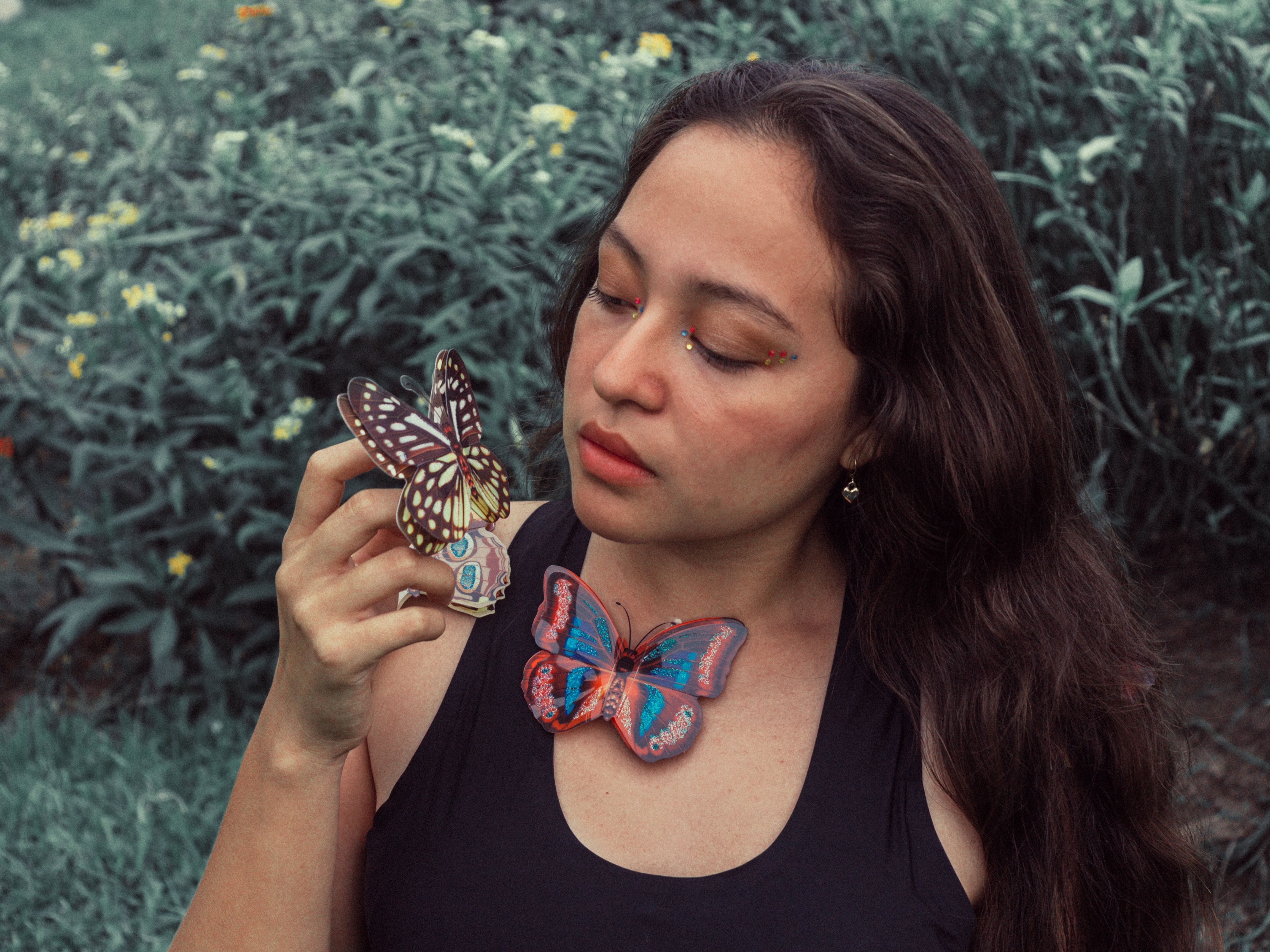 Woman with Butterflies in Natural Setting · Free Stock Photo