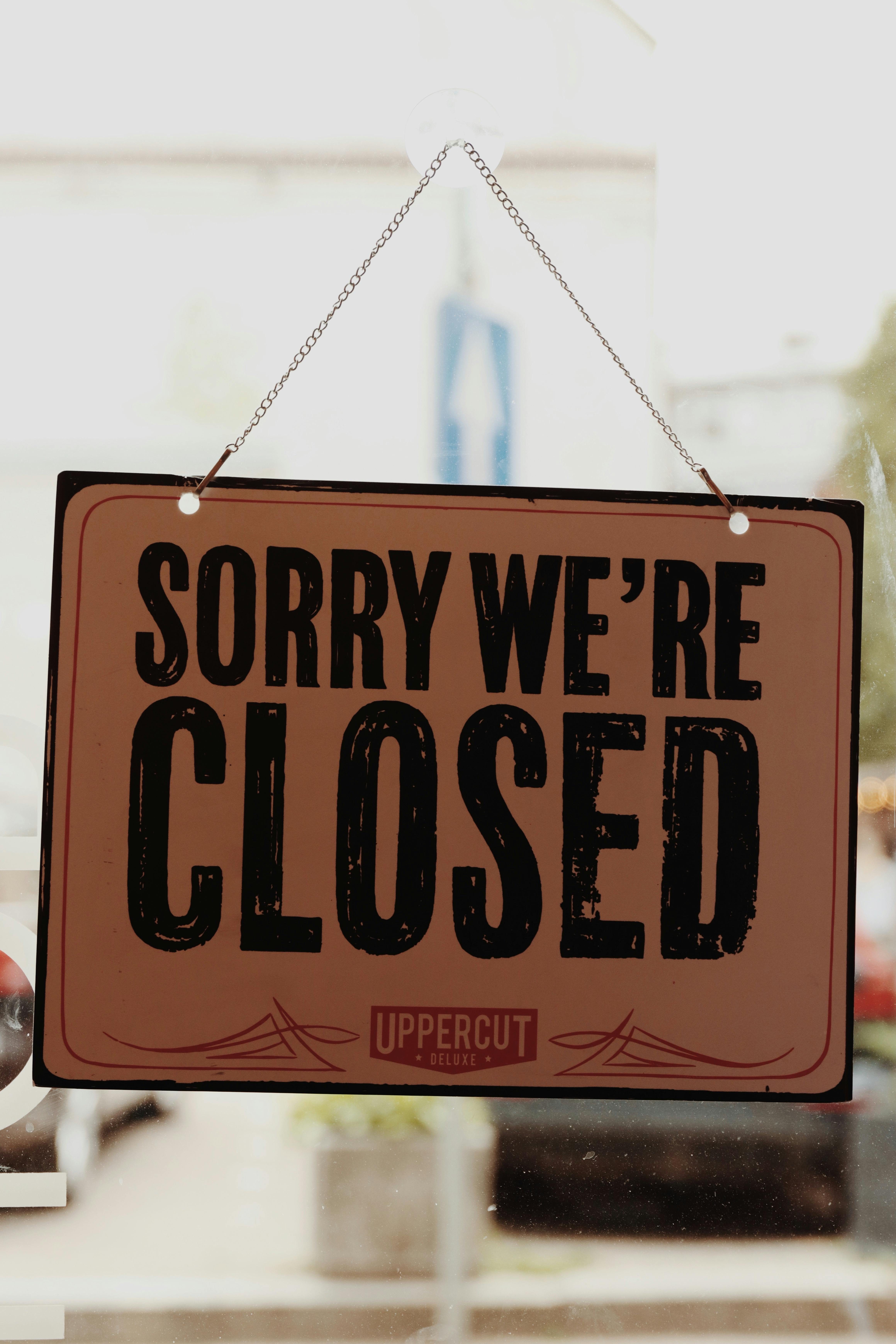 Vintage 'Closed' Sign Hanging in Riga Shop Window · Free Stock Photo