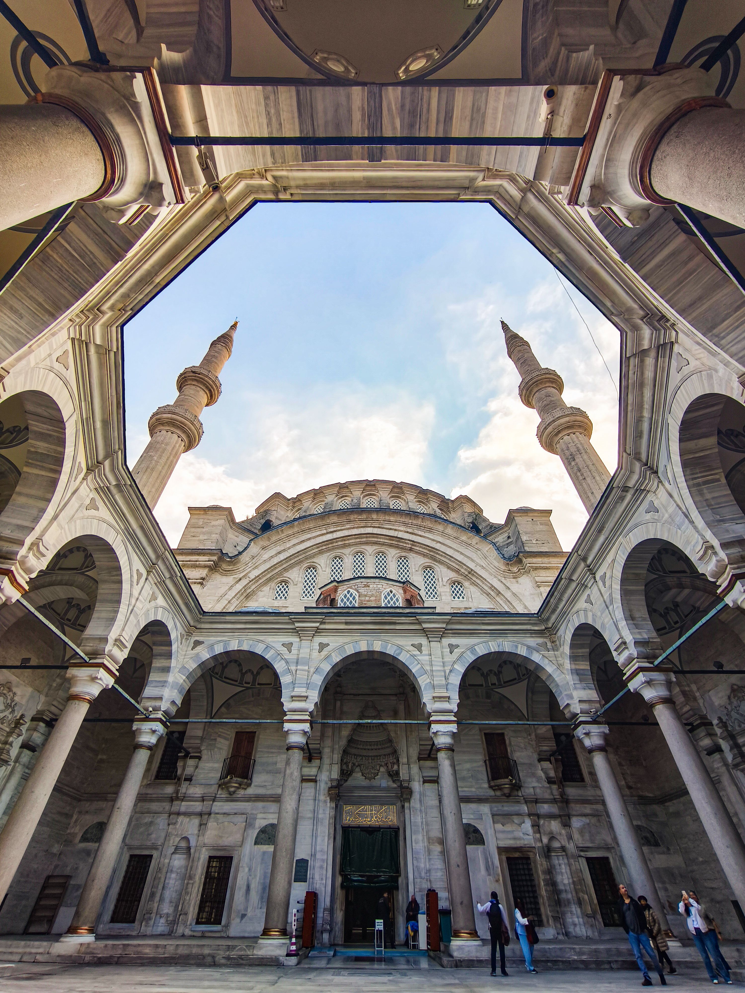 Courtyard and arched passage of medieval mosque · Free Stock Photo